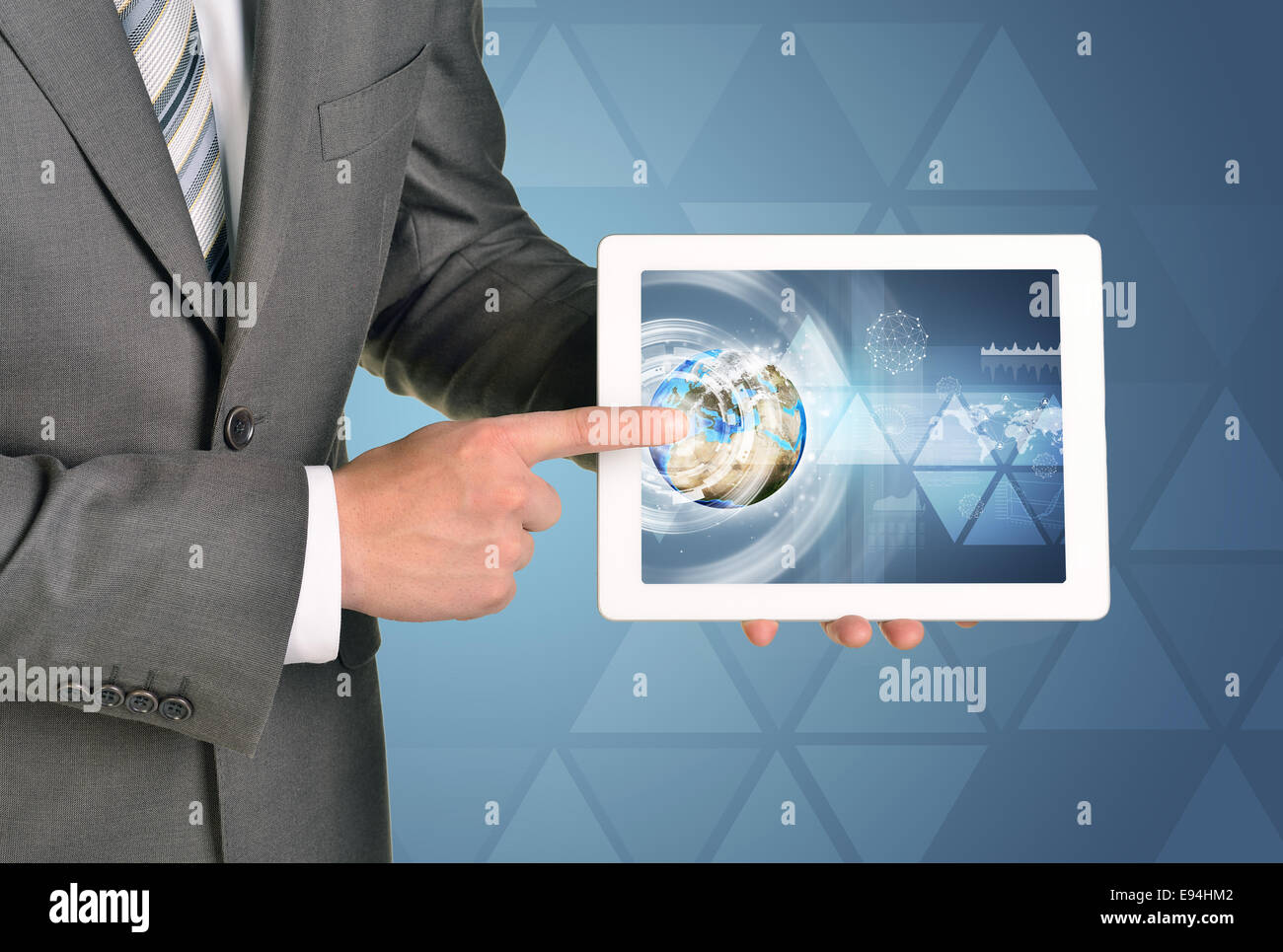 Man hands using tablet pc. Image of Earth on screen Stock Photo - Alamy