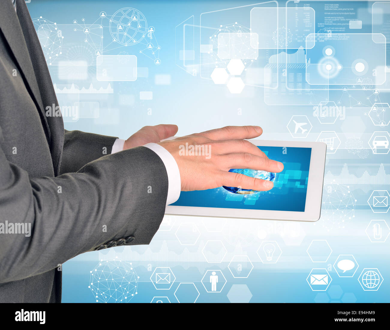 Man hands using tablet pc. Image of Earth on screen Stock Photo - Alamy