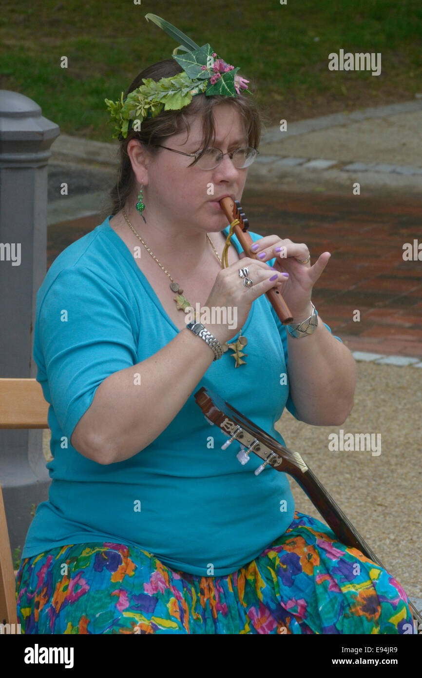 Woman playing a flute Stock Photo - Alamy