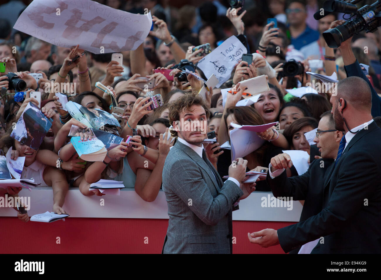 Rome, Italy. 19th Oct, 2014. Sam Claflin signs autograph on the Red ...