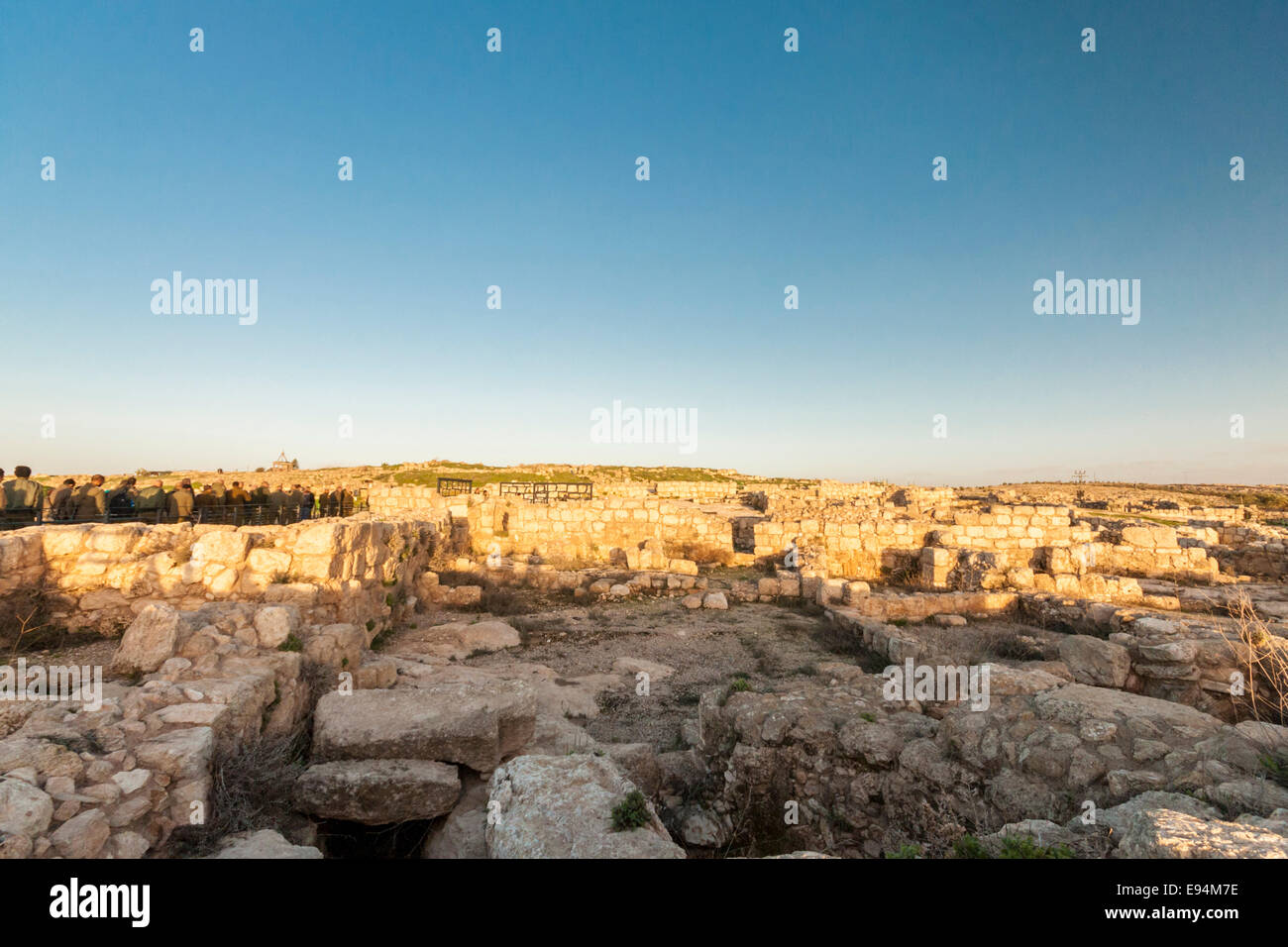 Israel / West Bank. A group of Soldiers (Left) walks in the ruins of ...