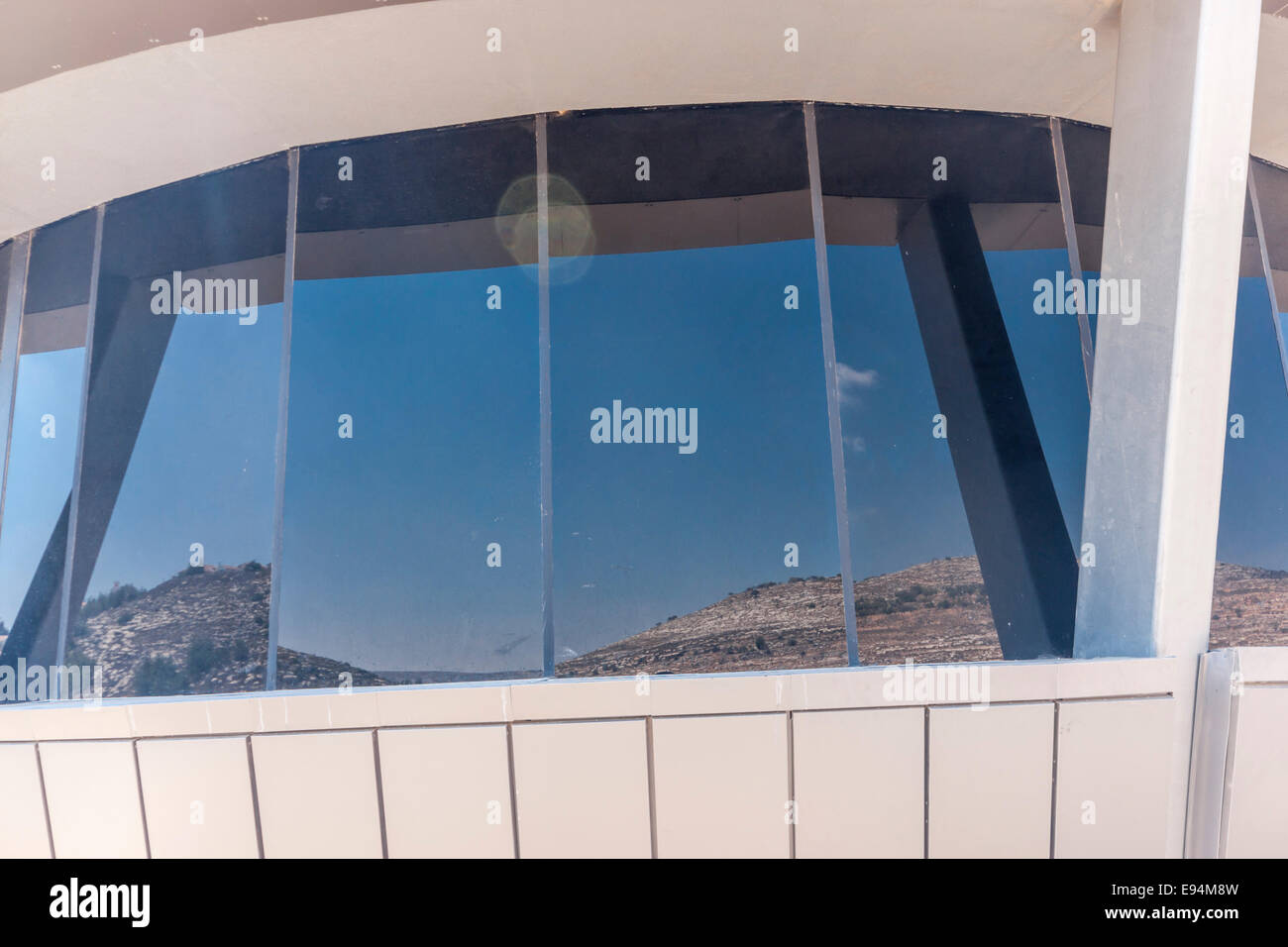 Israel. The Judean mountains reflection on the windows of the ...