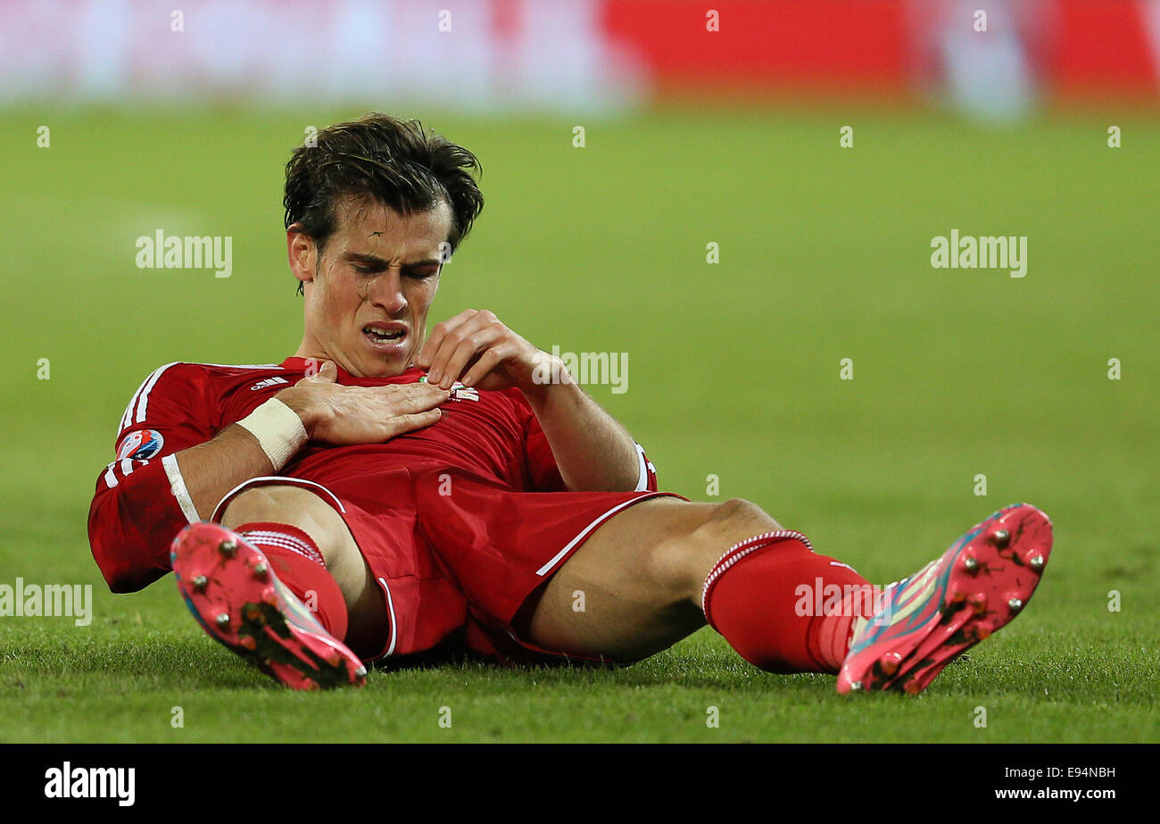Cardiff, UK. 13th Oct, 2014. Gareth Bale of Wales rests to being fouled ...