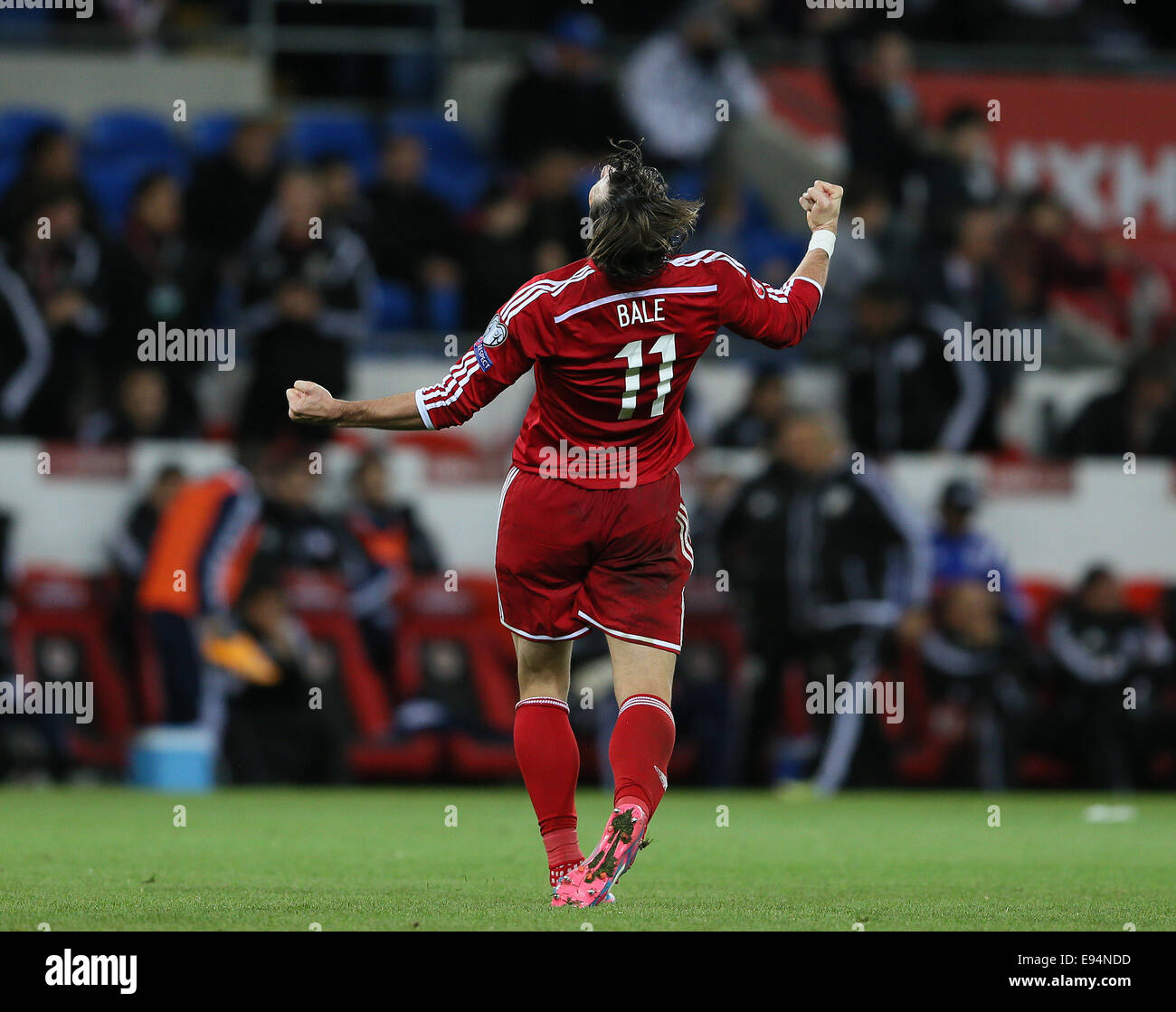 Cardiff, UK. 13th Oct, 2014. Gareth Bale of Wales arches his back and ...