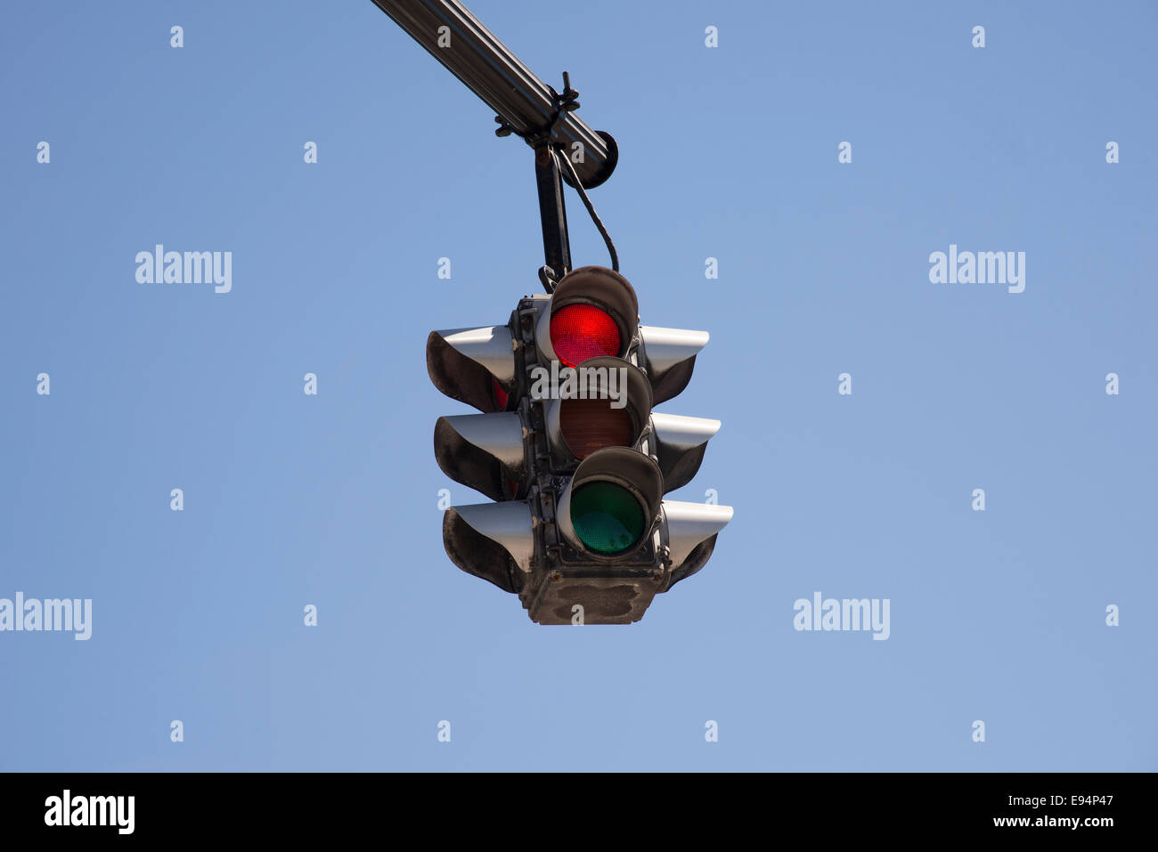 Red traffic light hanging from pole Stock Photo - Alamy
