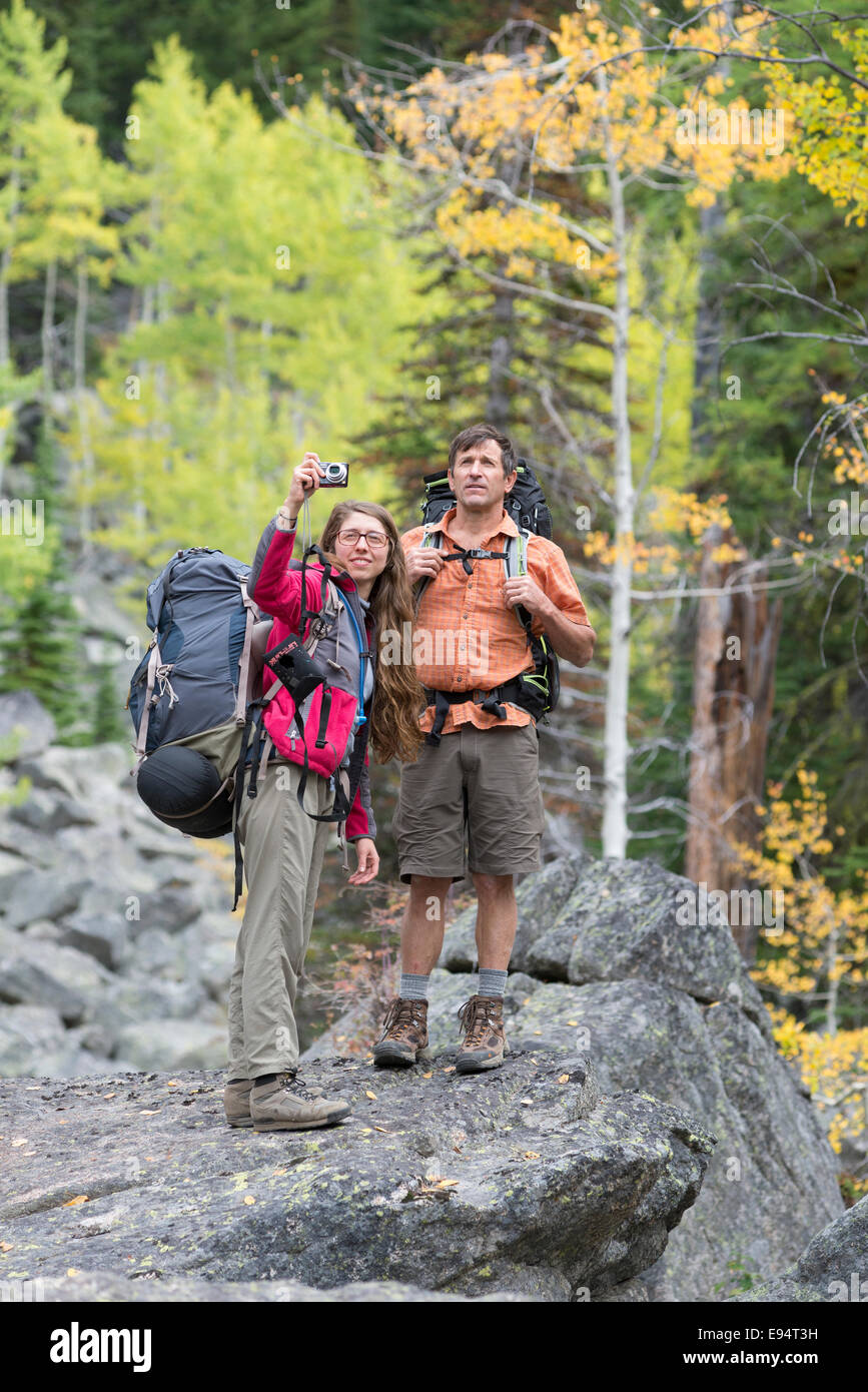 Backpacker taking a photograph in Oregon's Wallowa Mountains Stock ...