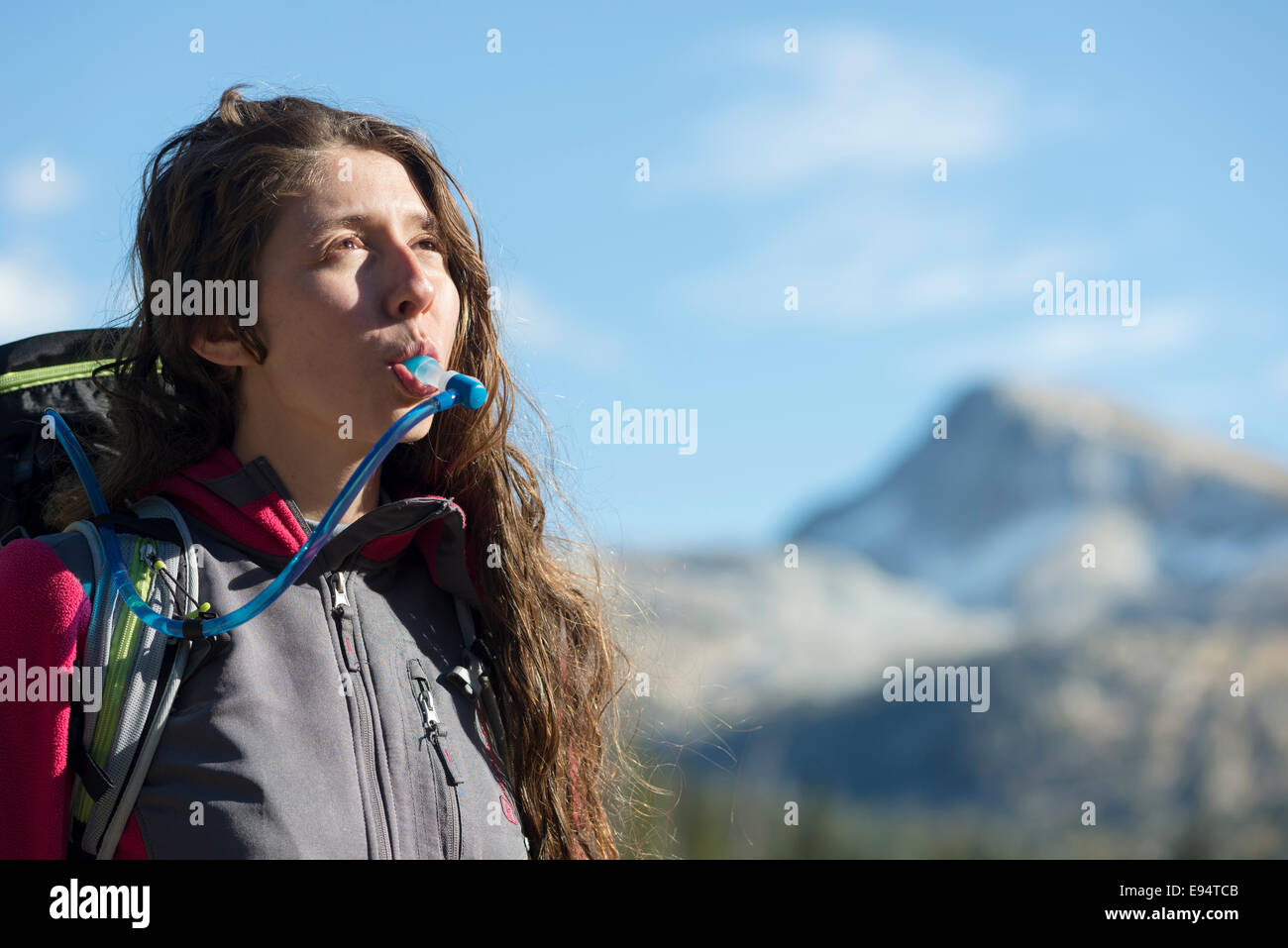 Hiker drinking from a hydration tube Stock Photo - Alamy
