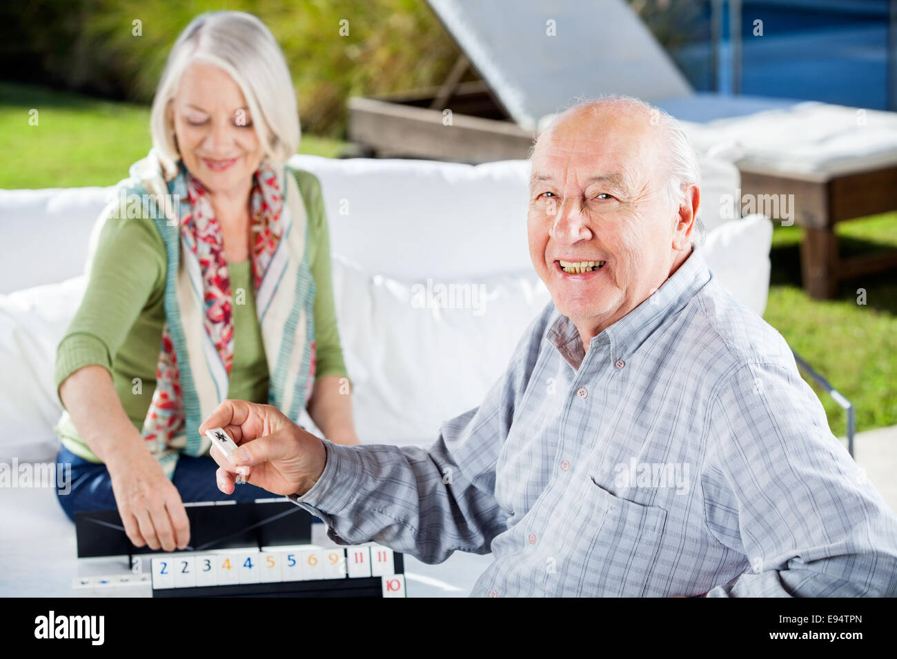 Happy Senior Man Playing Rummy With Woman Stock Photo - Alamy
