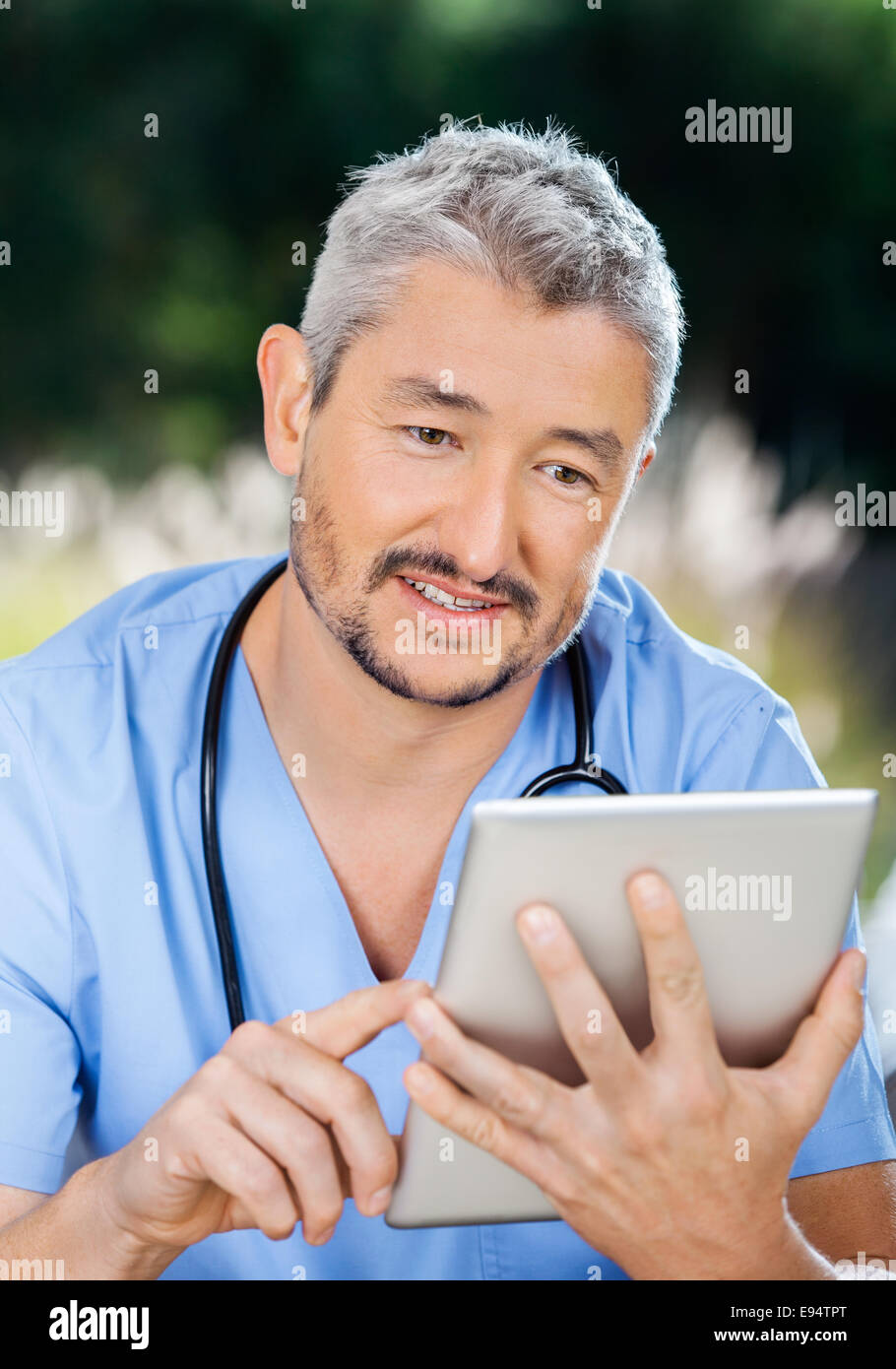 Male Nurse Using Tablet Computer Stock Photo - Alamy