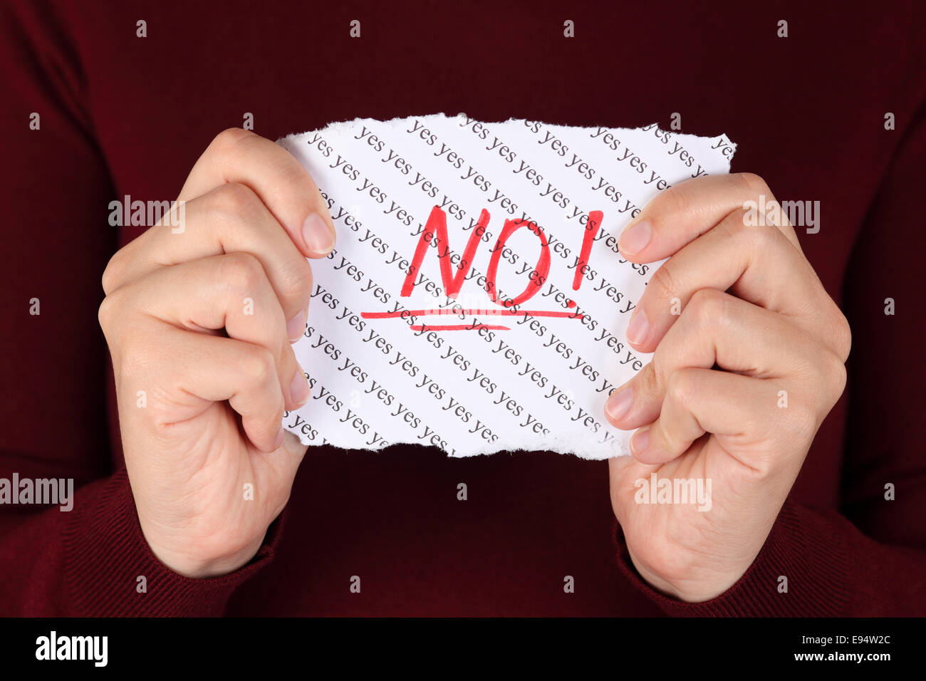Piece of paper with red word "No!" on background with words "yes" in ...