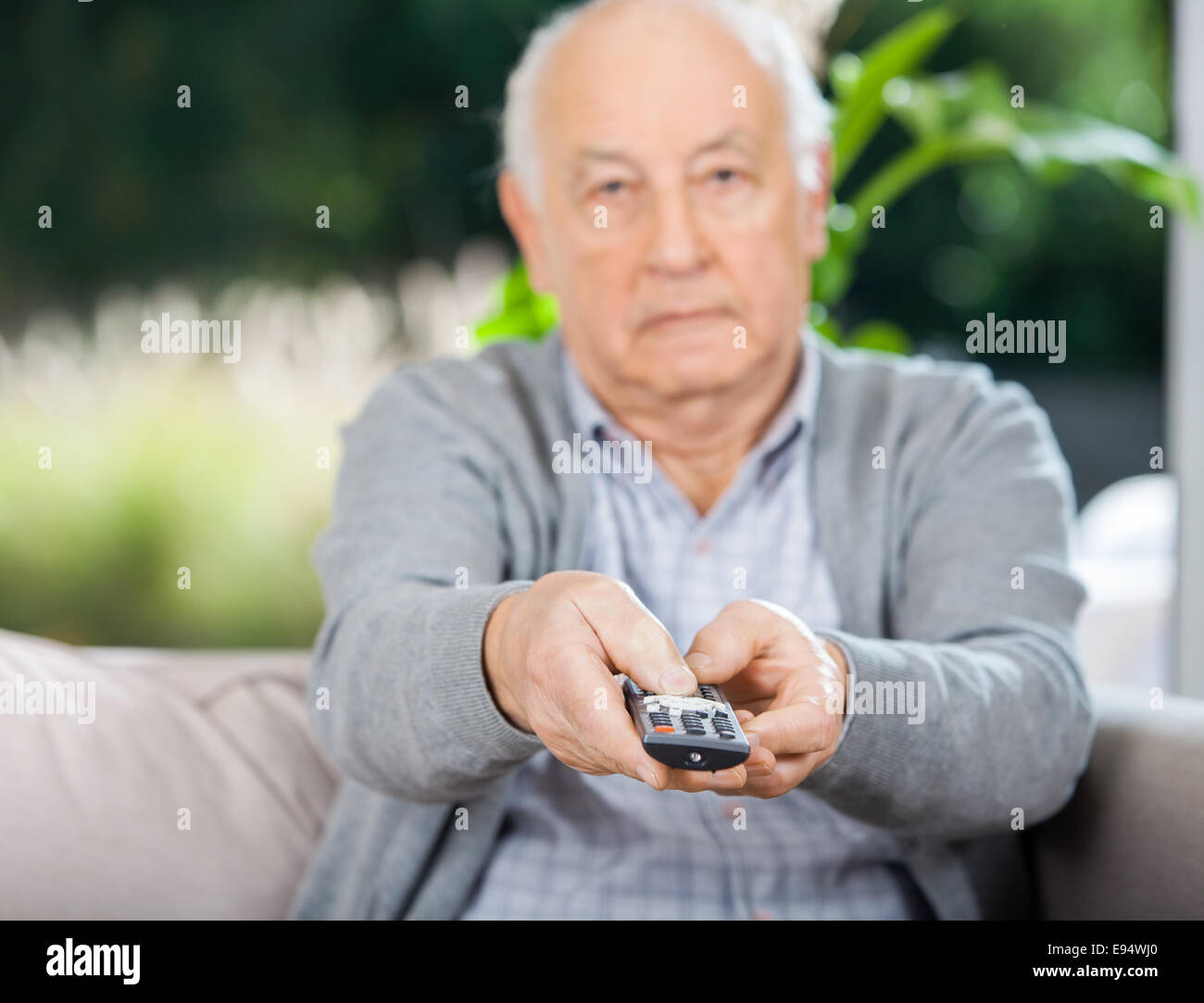 Man using remote control hi-res stock photography and images - Alamy