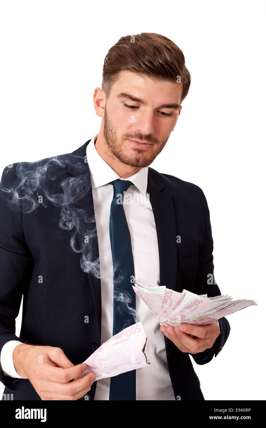 Man burning money hi-res stock photography and images - Alamy