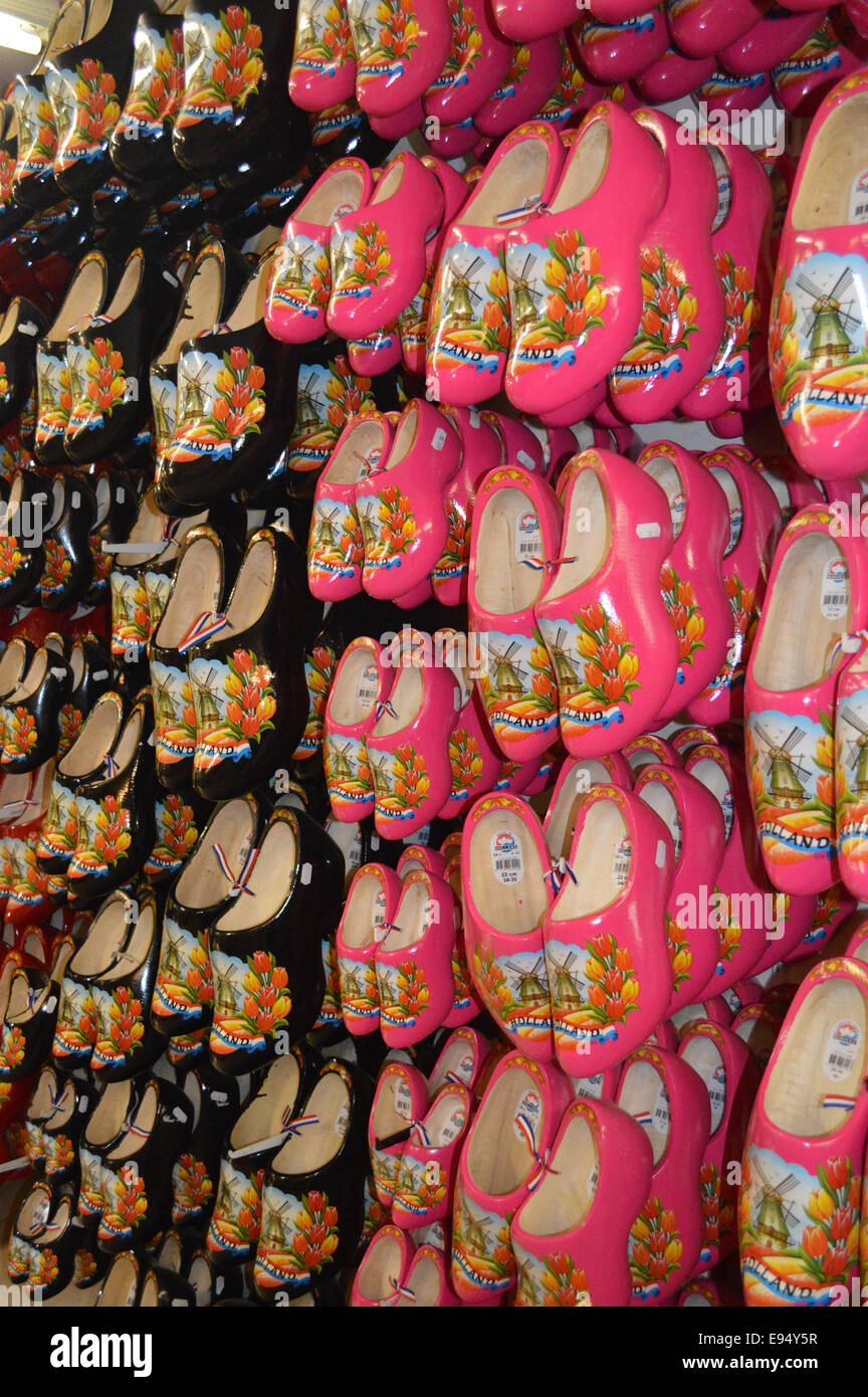Pink and Black Decorated Wooden Clogs Hanging Down on display in a shop ...