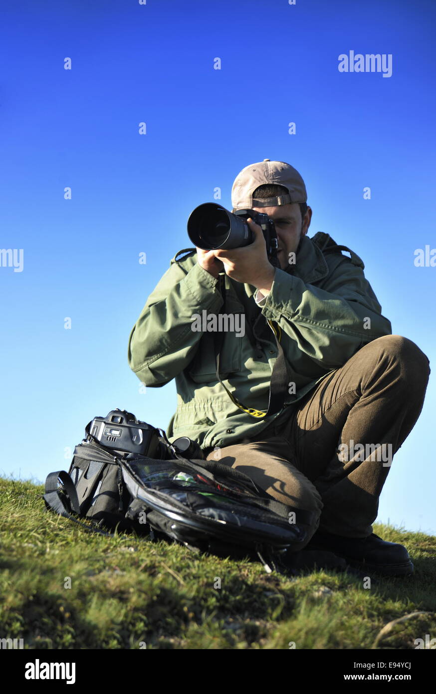 Nature photographer with digital camera Stock Photo - Alamy