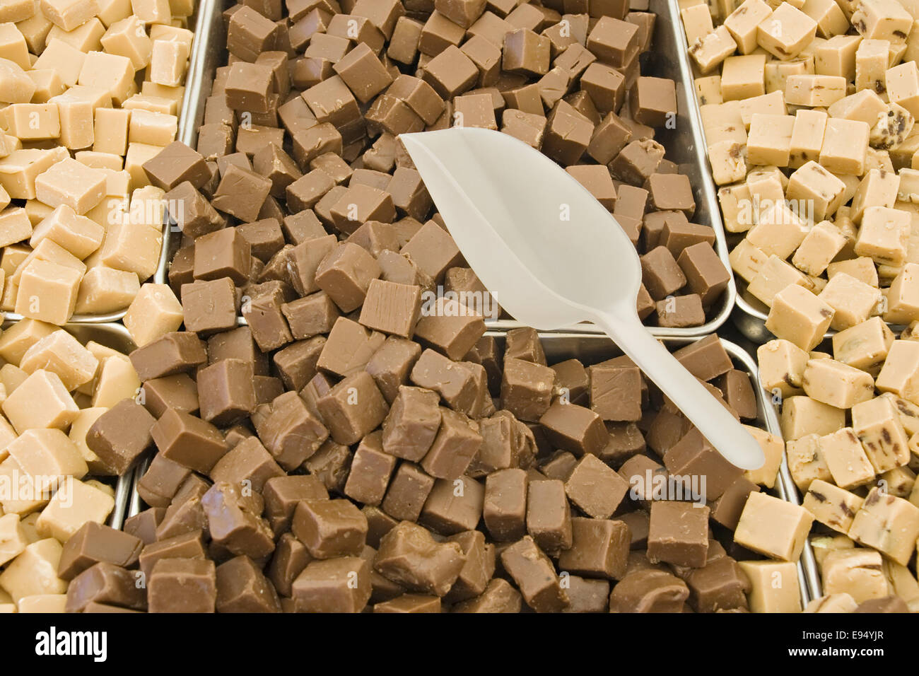 Brown and yellow toffee cubes in a market Stock Photo - Alamy