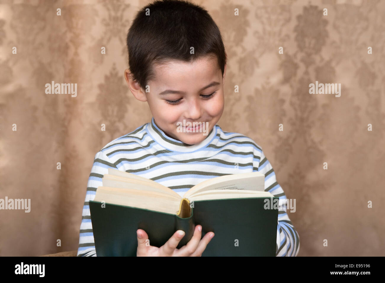 Boy and book Stock Photo - Alamy
