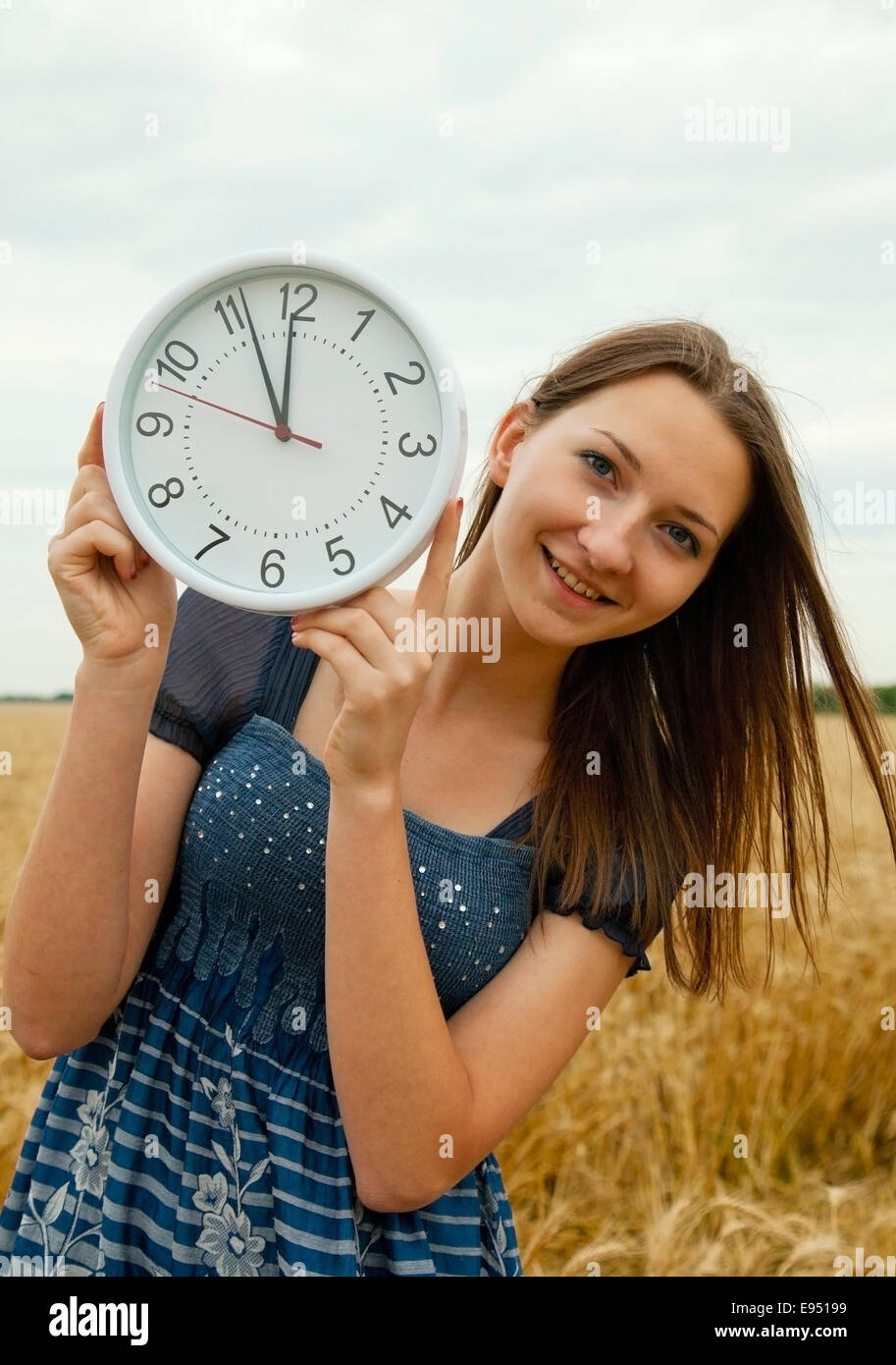 Teen girl holds watches Stock Photo - Alamy