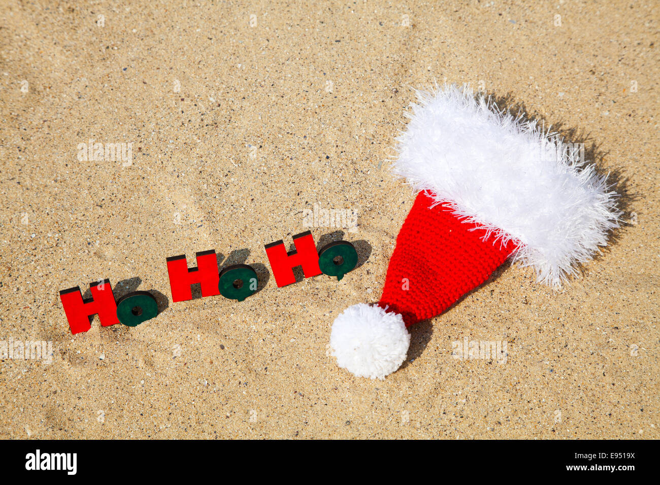 Wooden word 'Ho! Ho! Ho!' with Santa's hat Stock Photo - Alamy