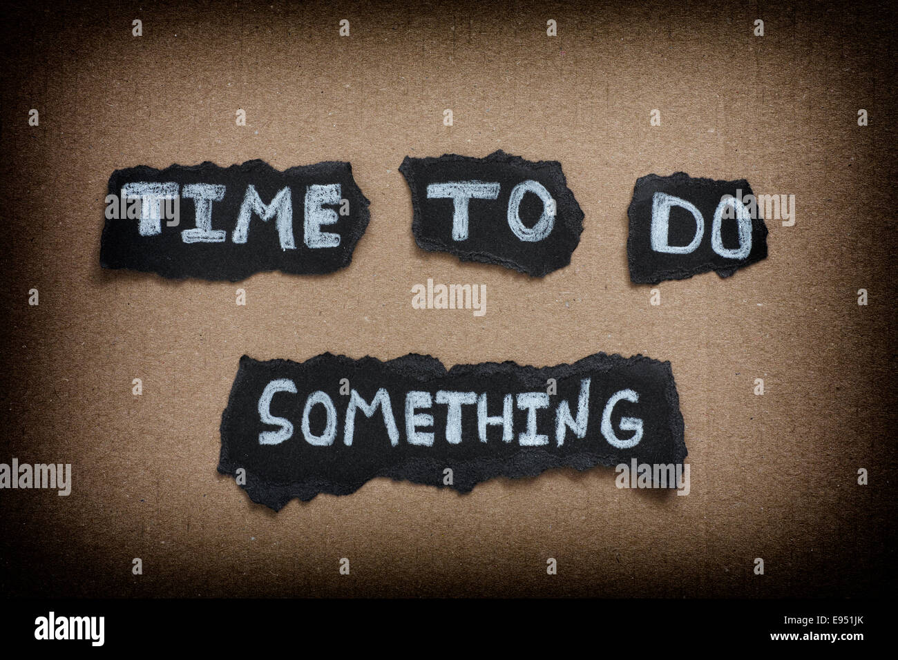 Time to do something. Brown paper background. Vignette Stock Photo - Alamy
