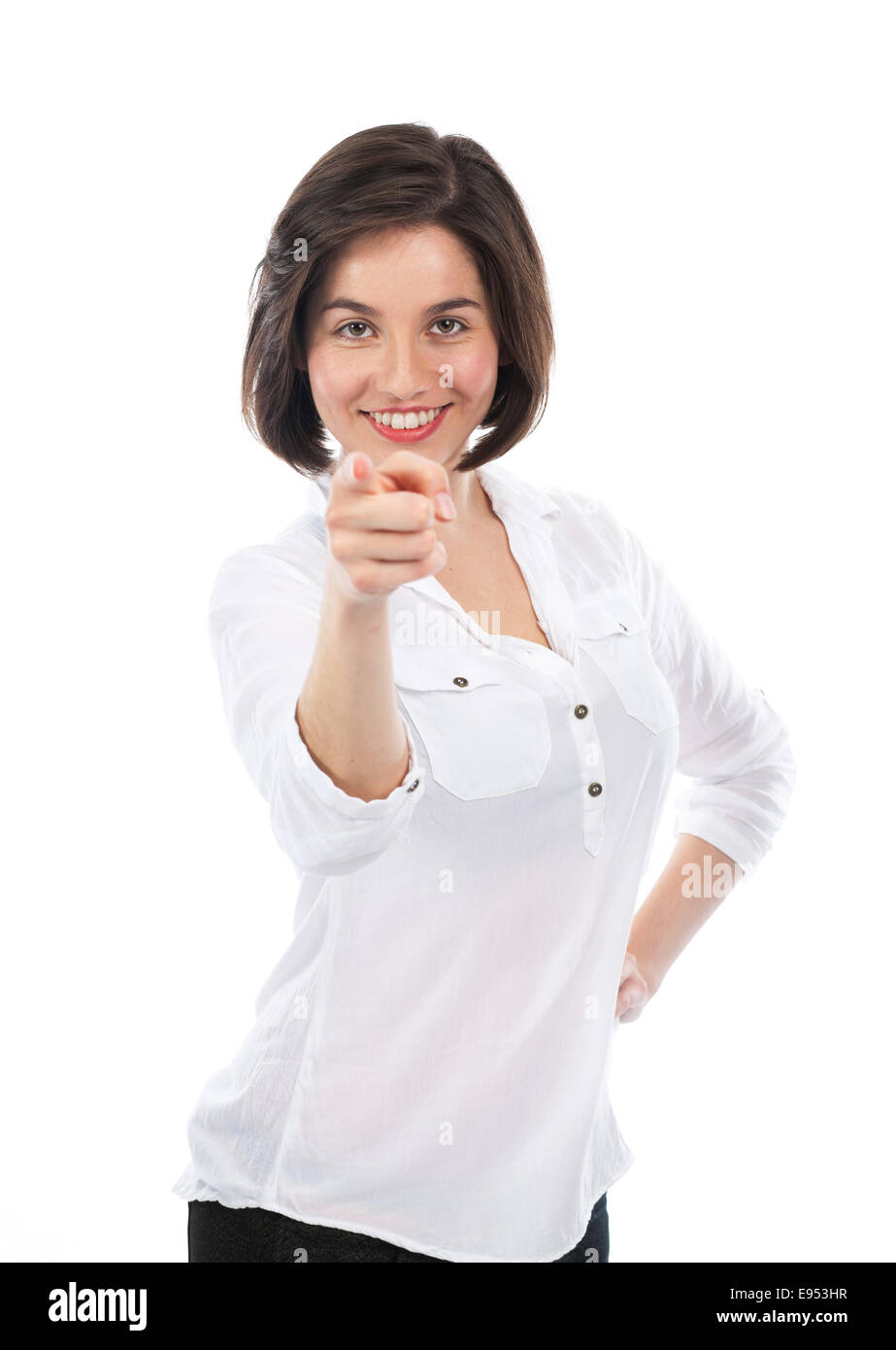 Portrait of a young woman pointing in front of her. Focus on her face ...