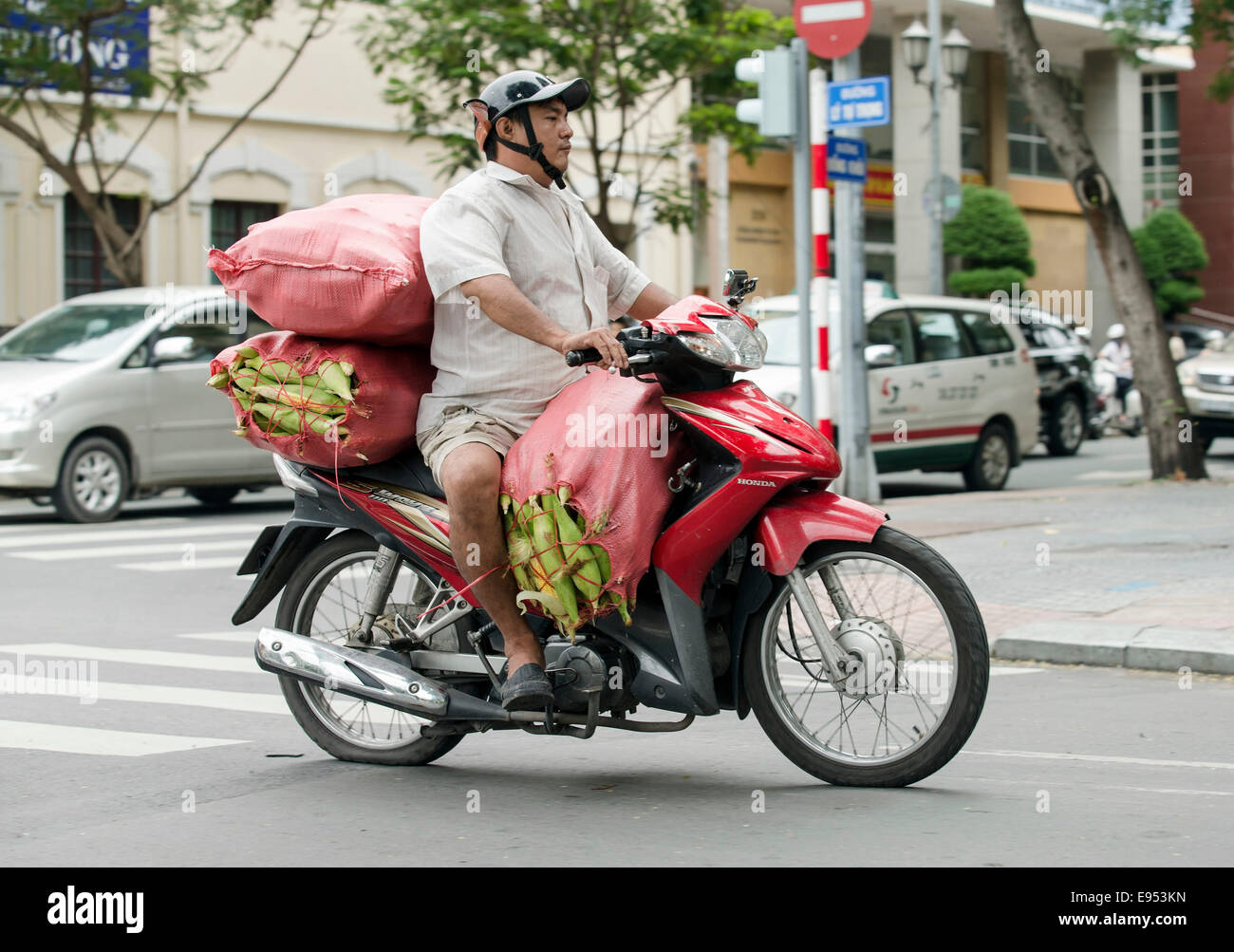 Man On Loaded Moped High Resolution Stock Photography and Images - Alamy