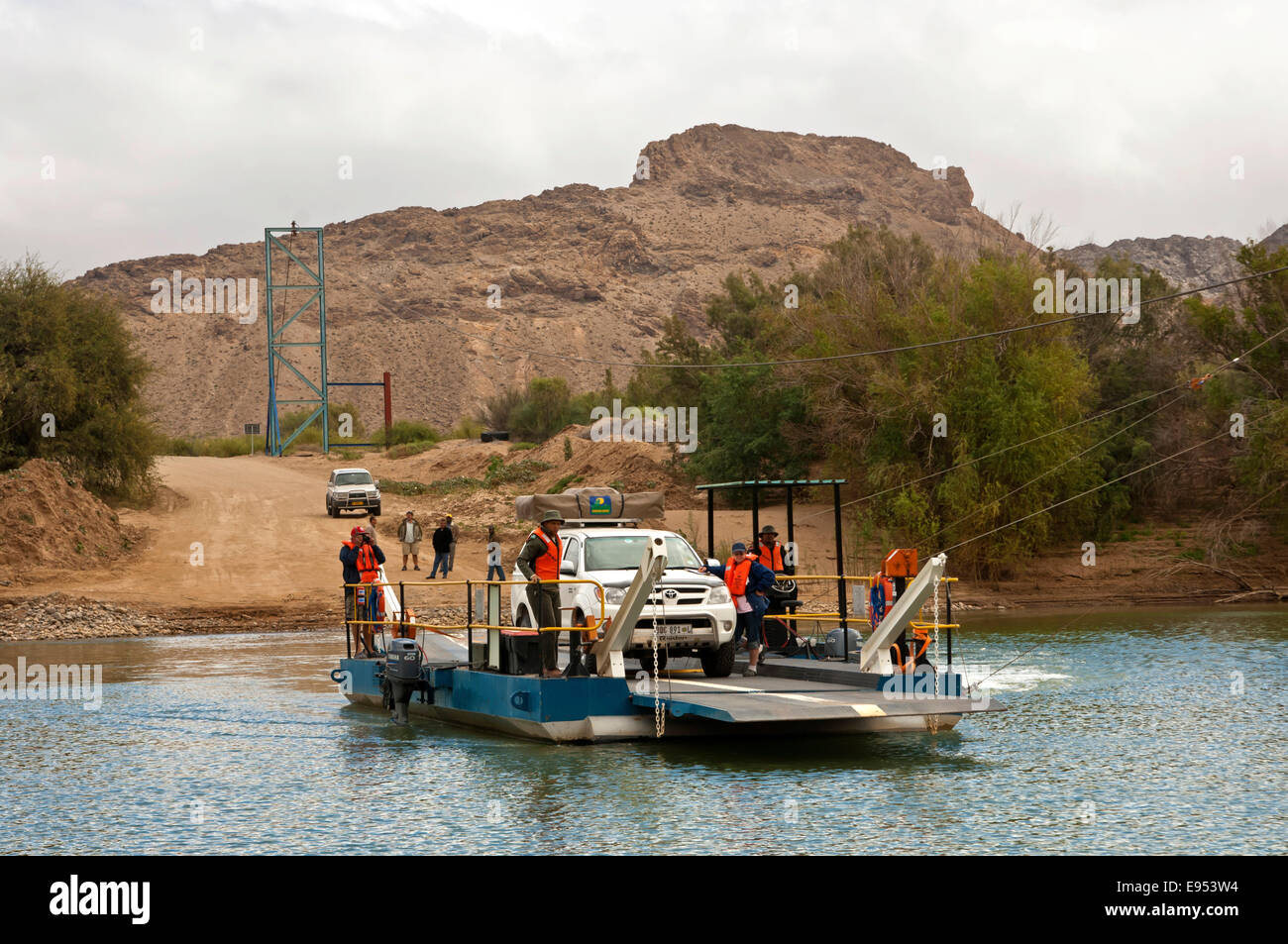 Car on the Octha ferry pontoon across the Orange River between South ...