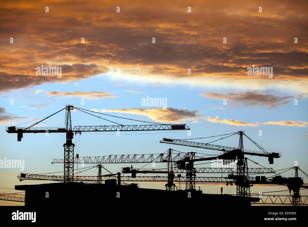 Color picture of some cranes on a construction site, as dusk Stock ...