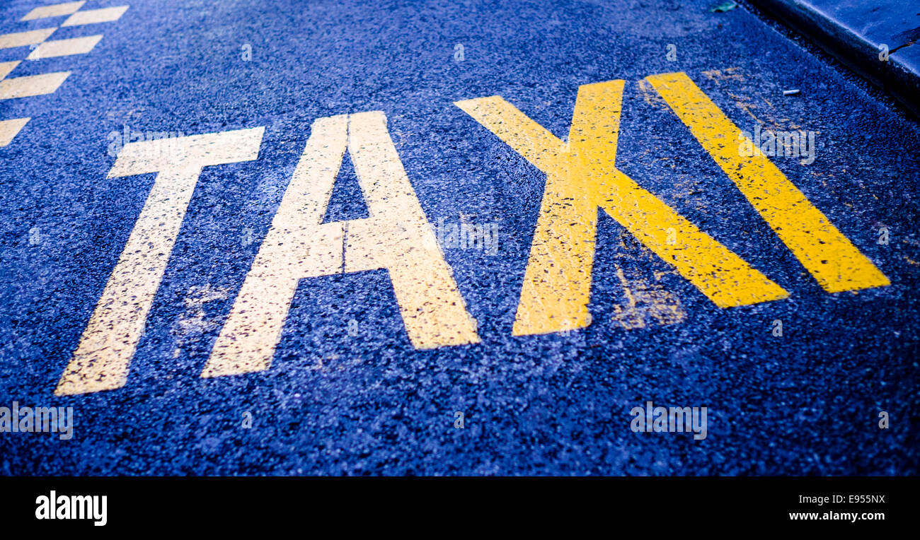 Taxi marking on a traffic lane Stock Photo - Alamy