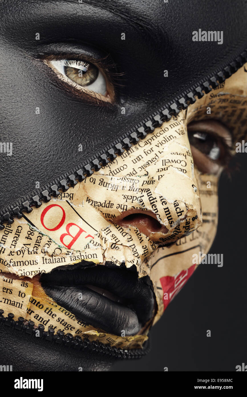 girl with black skin and make-up from the newspaper and lock zipper ...