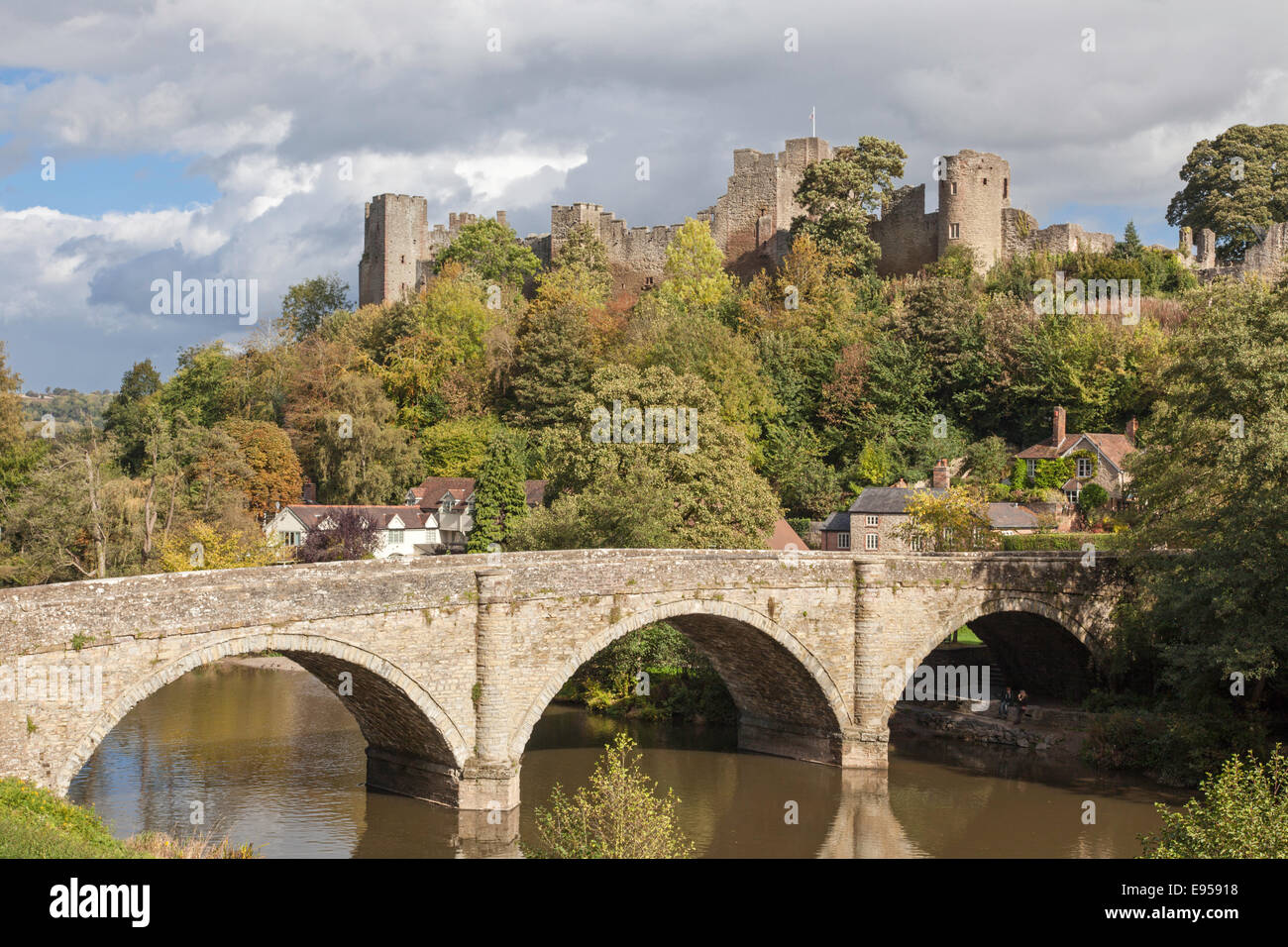 Dinham Bridge crossing the River Teme and Ludlow Castle in autumn color ...