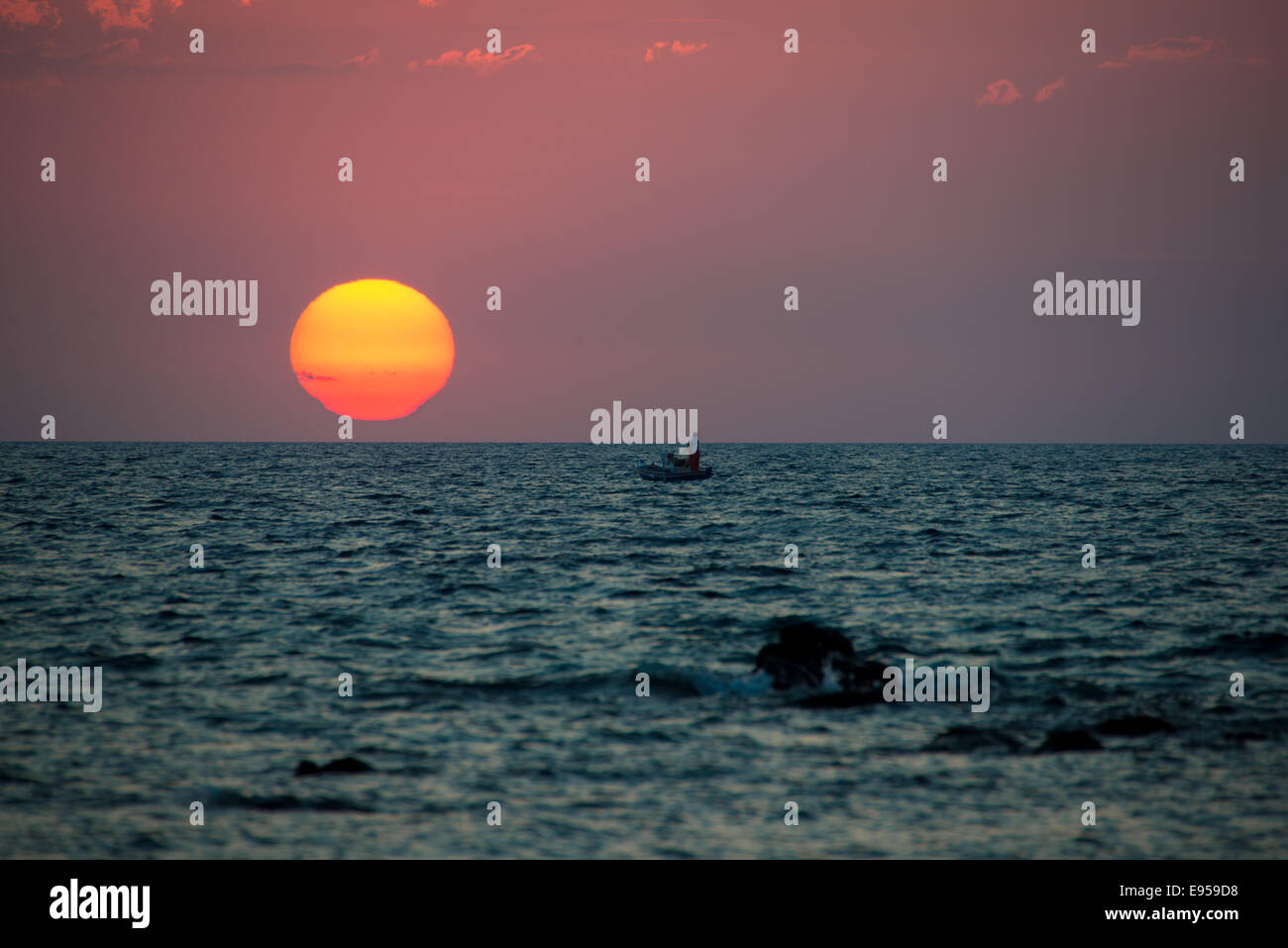 sunset at milos greece Stock Photo - Alamy