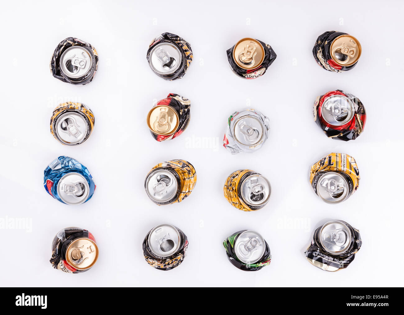Crushed disposable beer drink cans aluminium on white table background ...