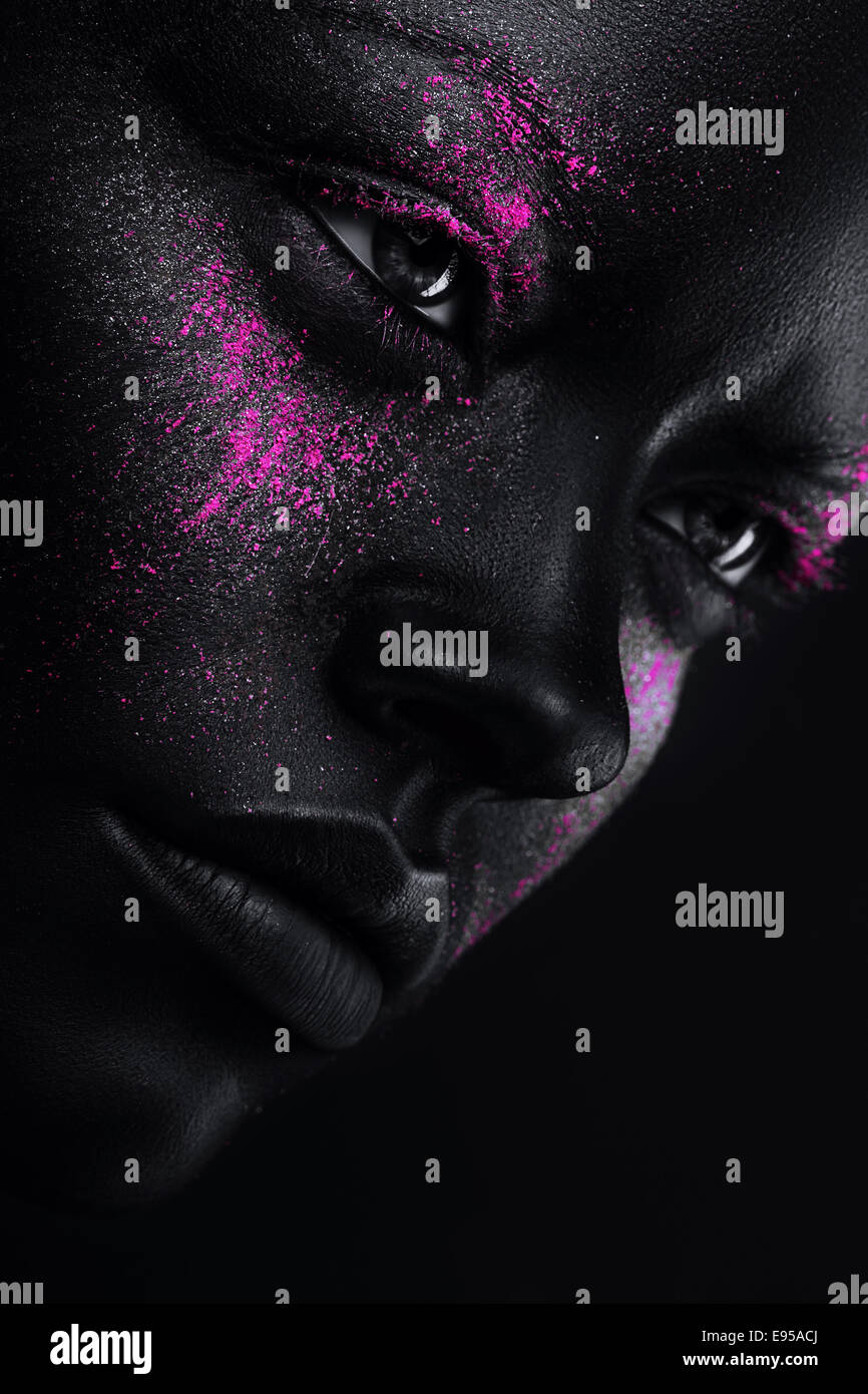 woman in black paint and neon pink powder Stock Photo - Alamy
