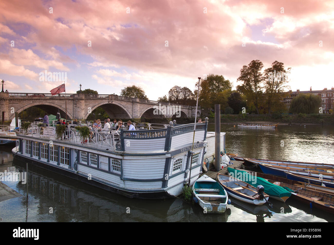 Restaurant barge moored alongside Richmond Bridge on the River Thames ...