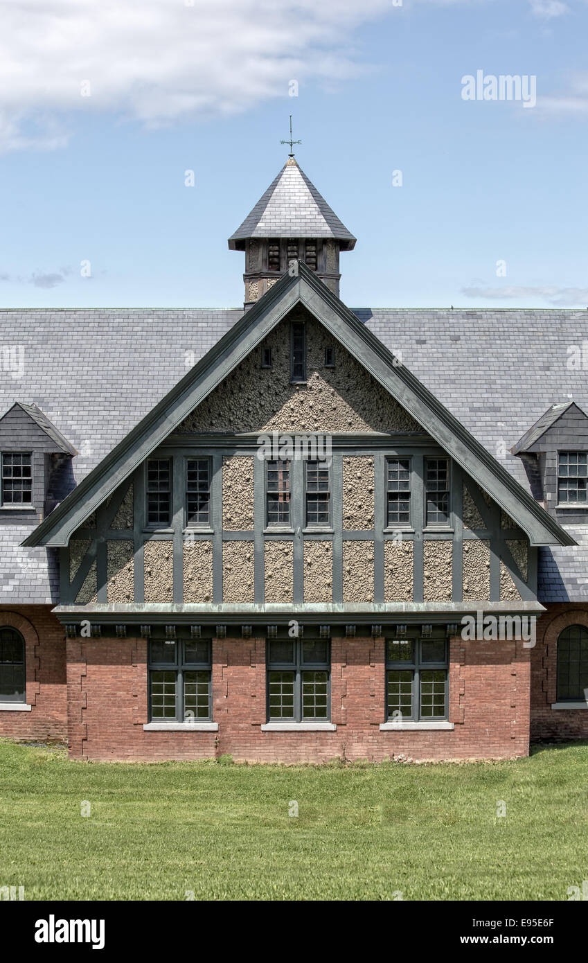 Straight on view of a large old house with brick and timber framing, a ...