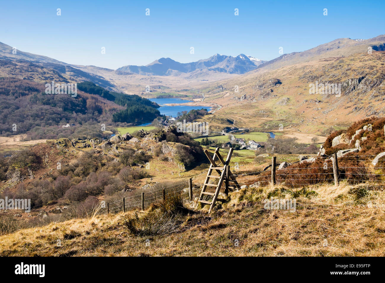 Ladder stile on footpath above Capel Curig with view to Nantygwryd and ...