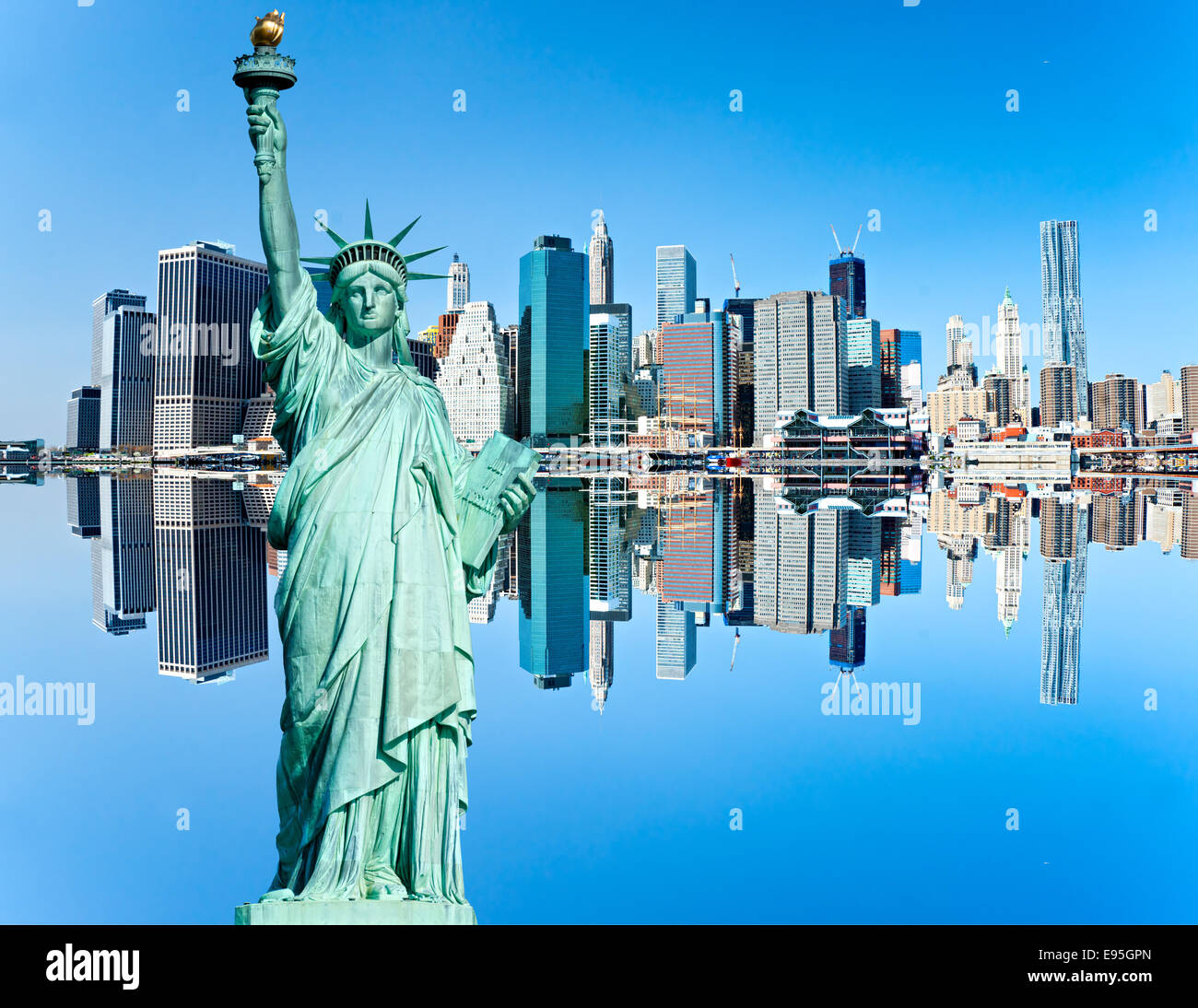 Manhattan and the statue of Liberty with reflection, New York City. USA ...