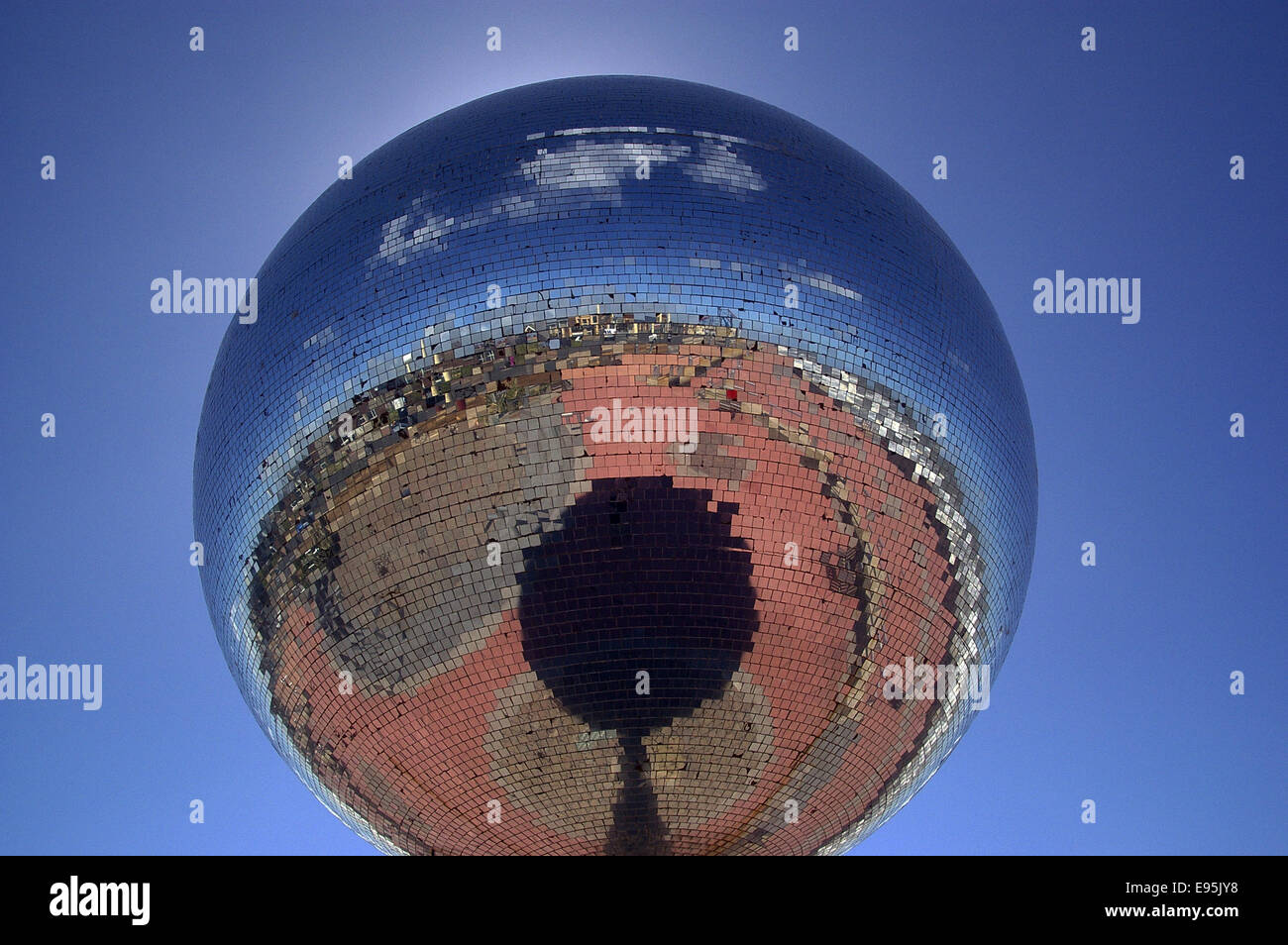 Reflections of the promenade and sky in the giant mirror ball at ...