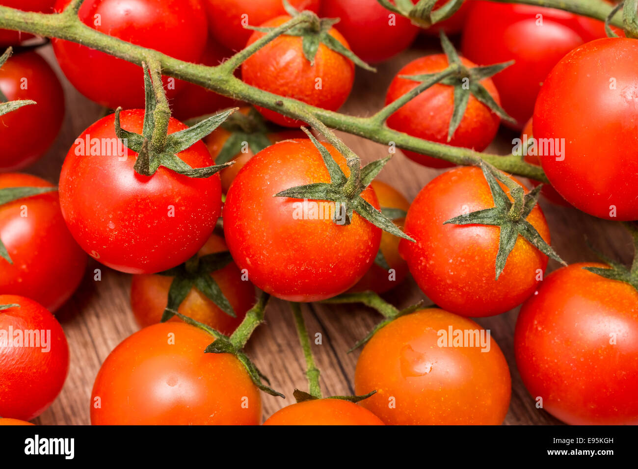 Cherry tomatoes on table hi-res stock photography and images - Alamy
