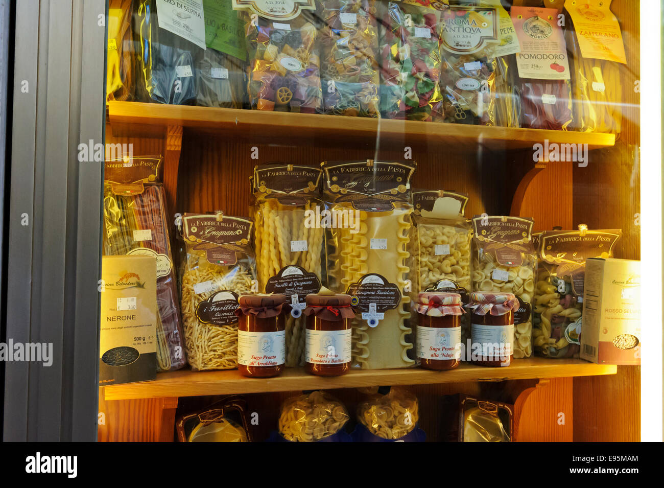 A cabinet on display containing raw pasta and healthy Italian cooking ...