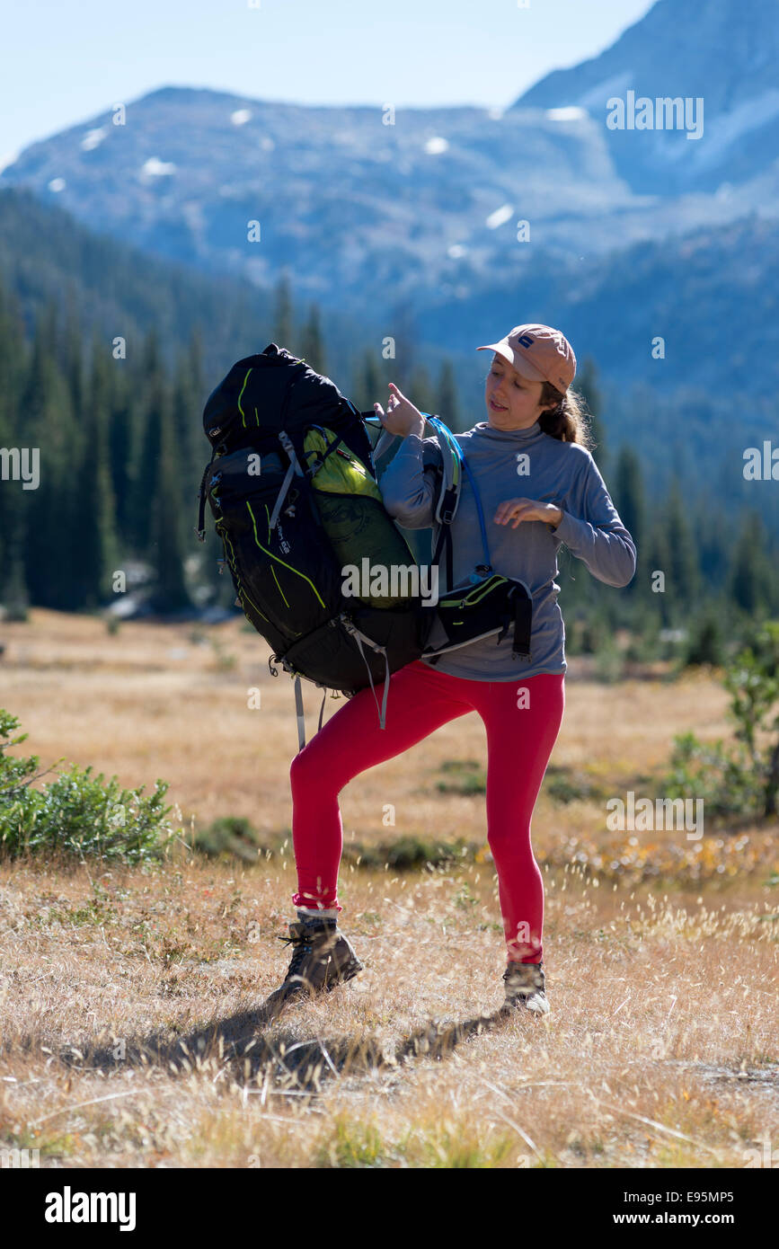 Putting on backpack hi-res stock photography and images - Alamy