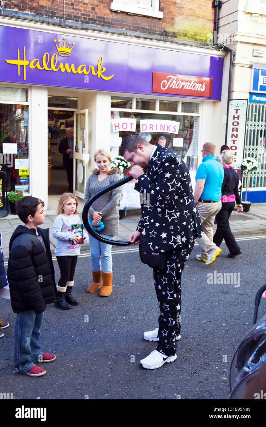 children's entertainer children entertained by balloon blowing up fun ...