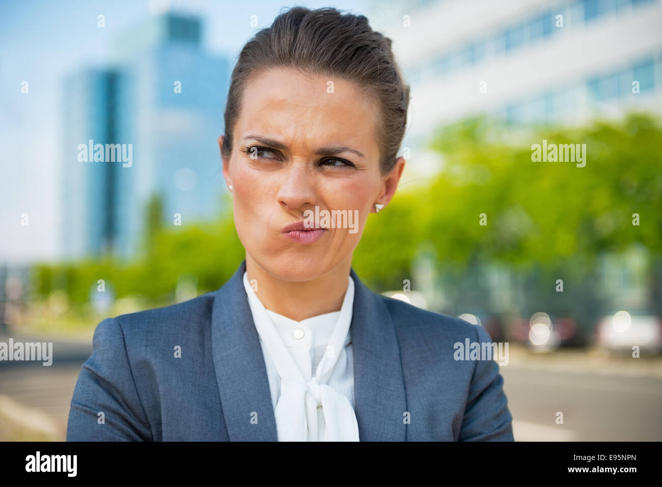 Portrait of thoughtful business woman in office district Stock Photo ... Portrait of thoughtful business woman in office district Stock Photo ...