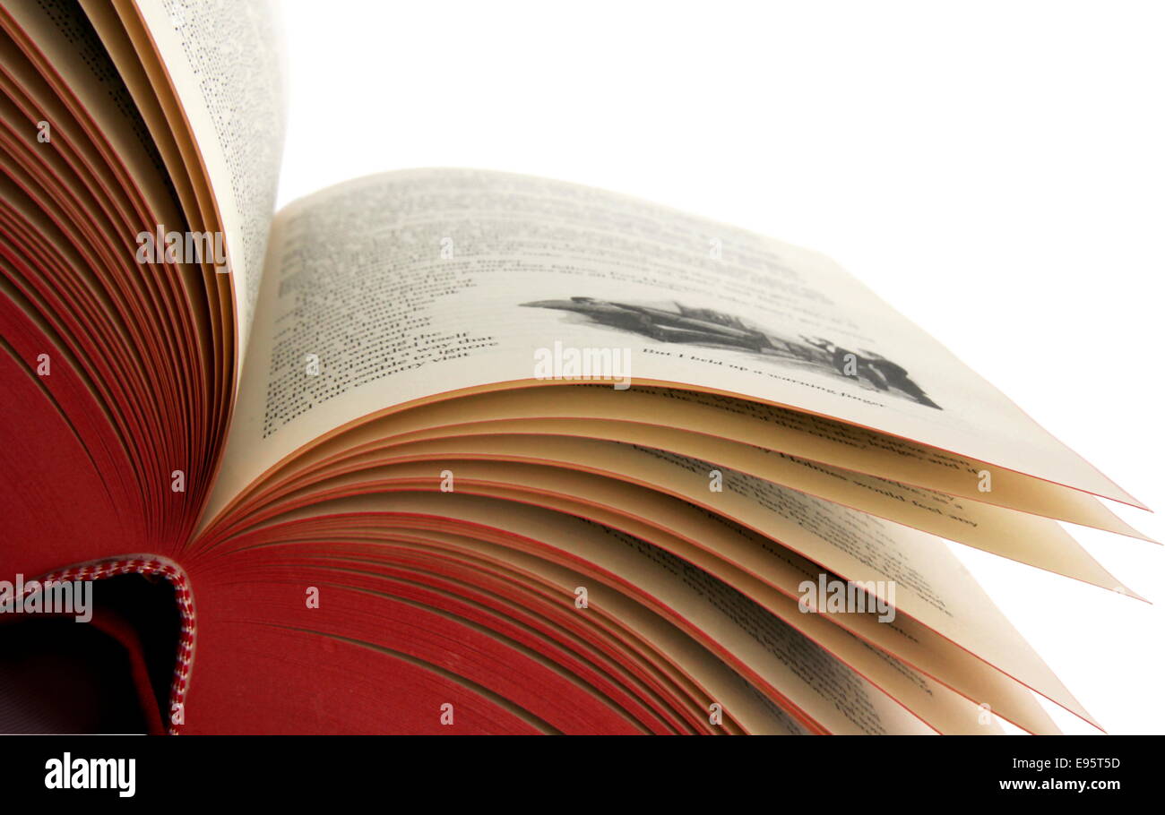 An open red book from an angle Stock Photo - Alamy