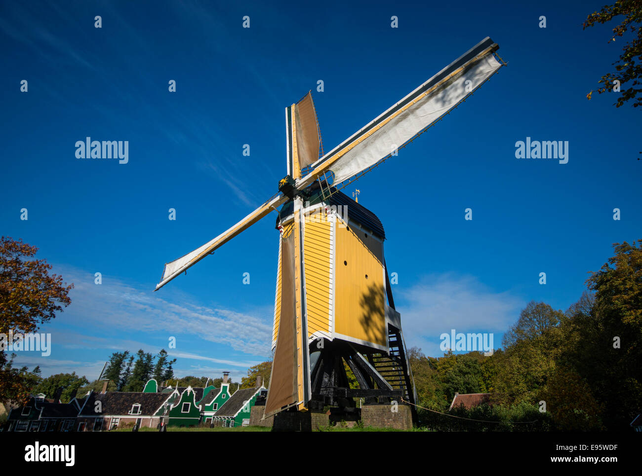 A yellow windmill at the Open Air Museum in Arnhem, the Netherlands ...
