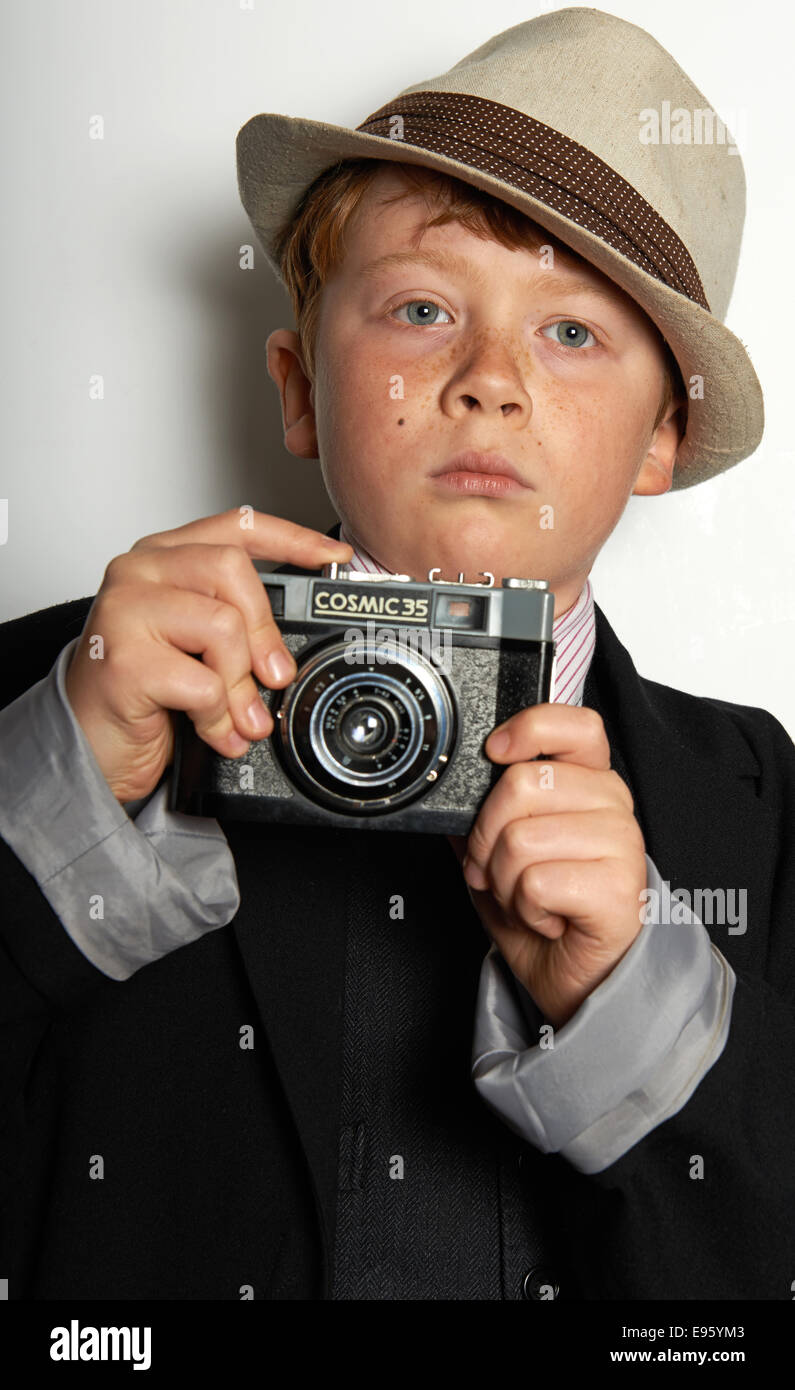Young boy taking photograph with a Cosmic 35 camera Stock Photo - Alamy