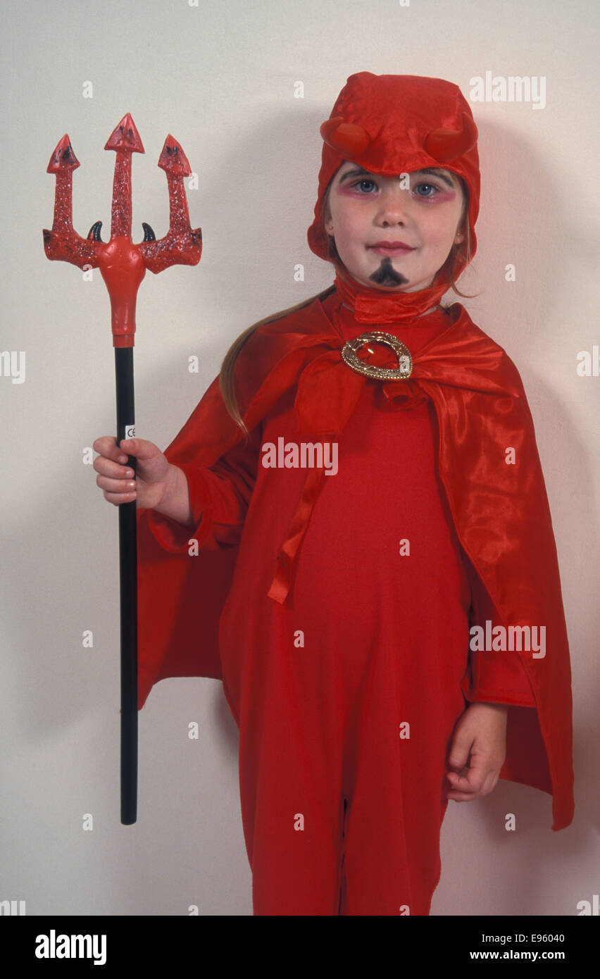 little girl dressed up in red devil costume for halloween Stock Photo ...