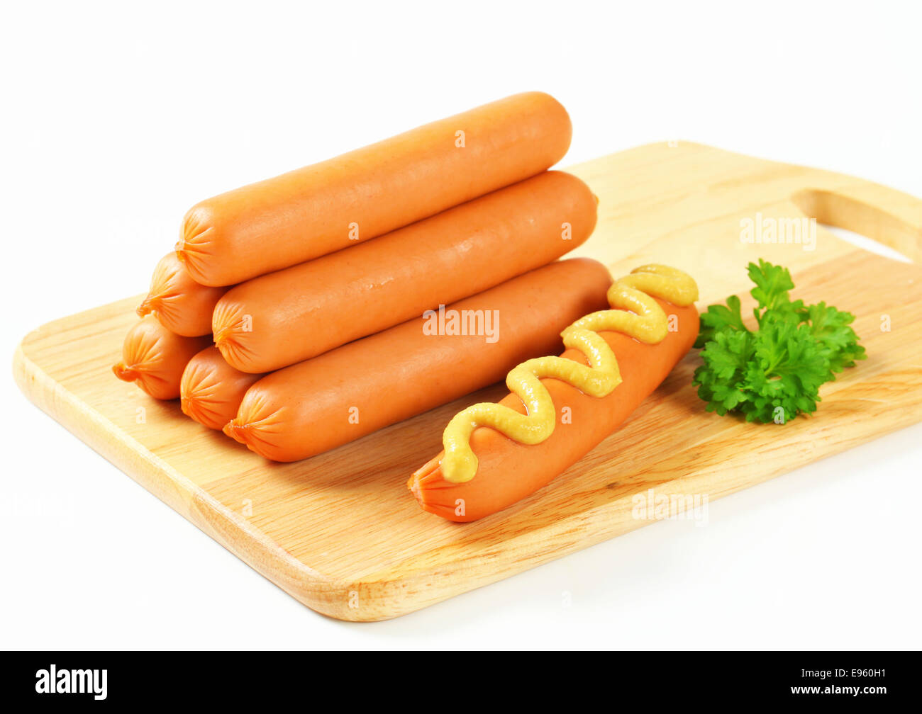 Stack of sausages on cutting board Stock Photo - Alamy