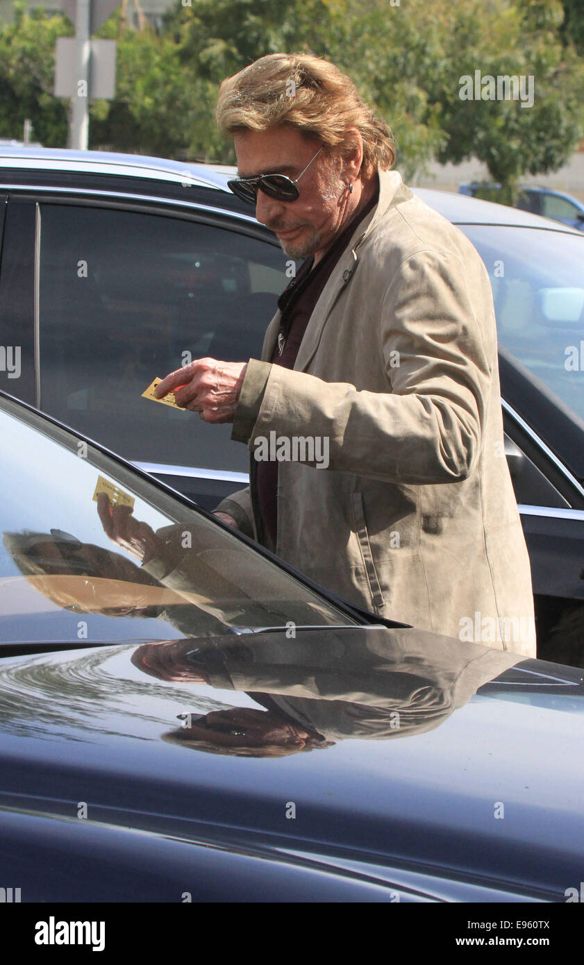 French singer and actor Johnny Hallyday arrive at his Bentley in the ...