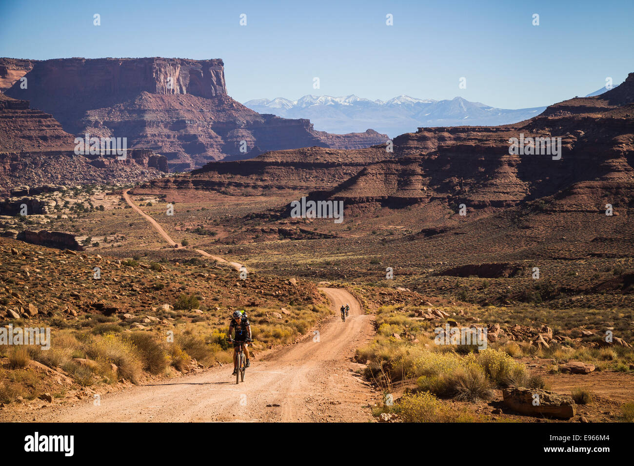 Mountain bikers riding up the Shafer trail section along the White Rim ...